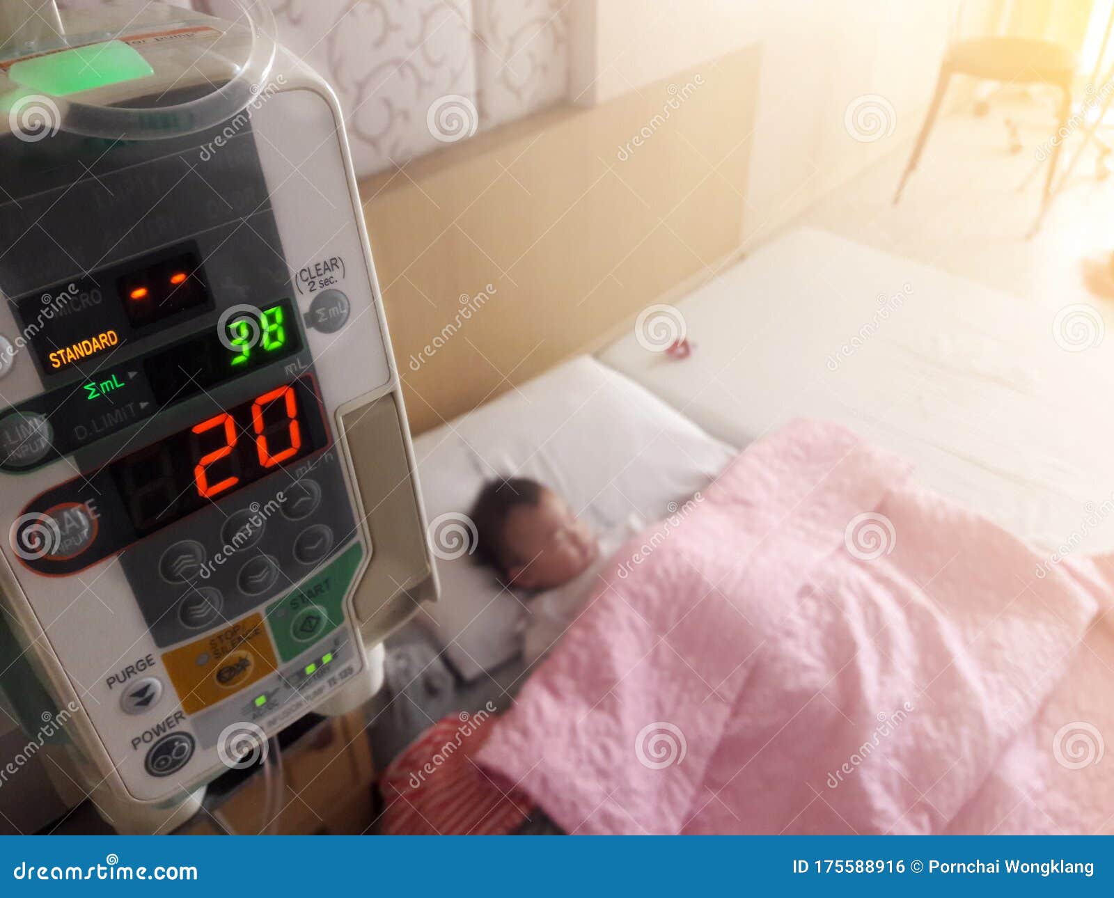 Close Up Injecting Saline Solution Machine and Blurred Child Background ...