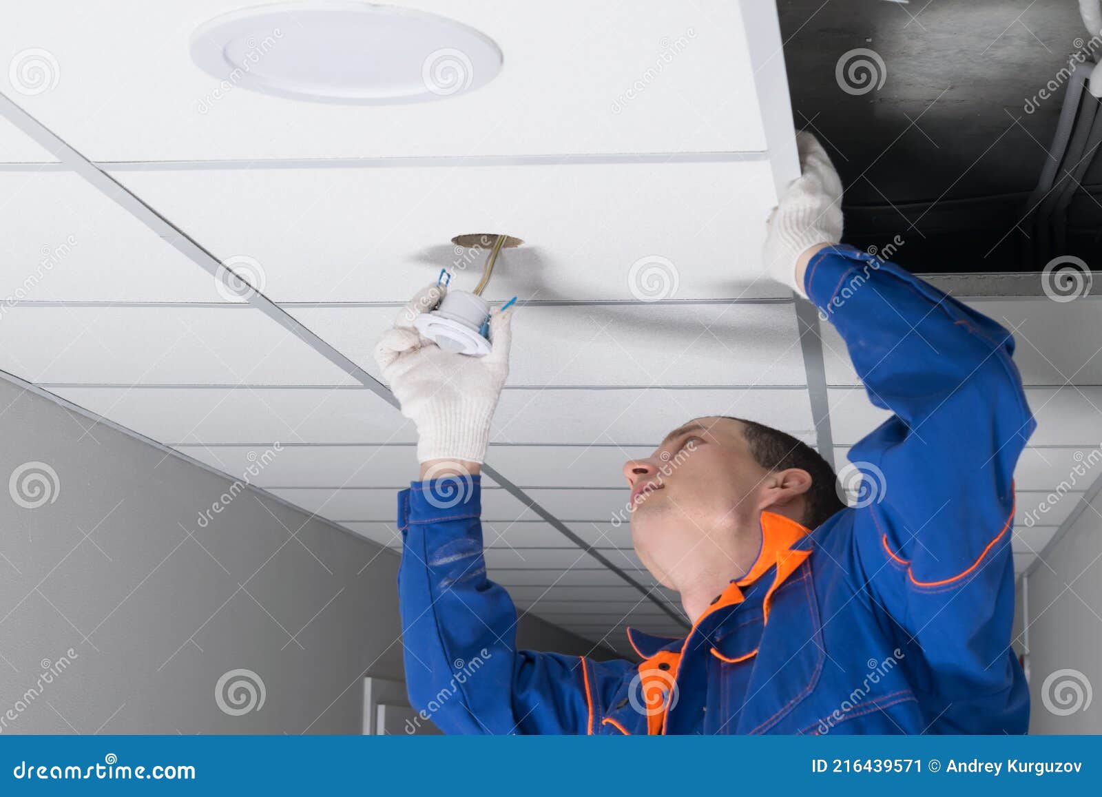 Close-up of the Installation of a Motion Sensor for Lighting Automation ...