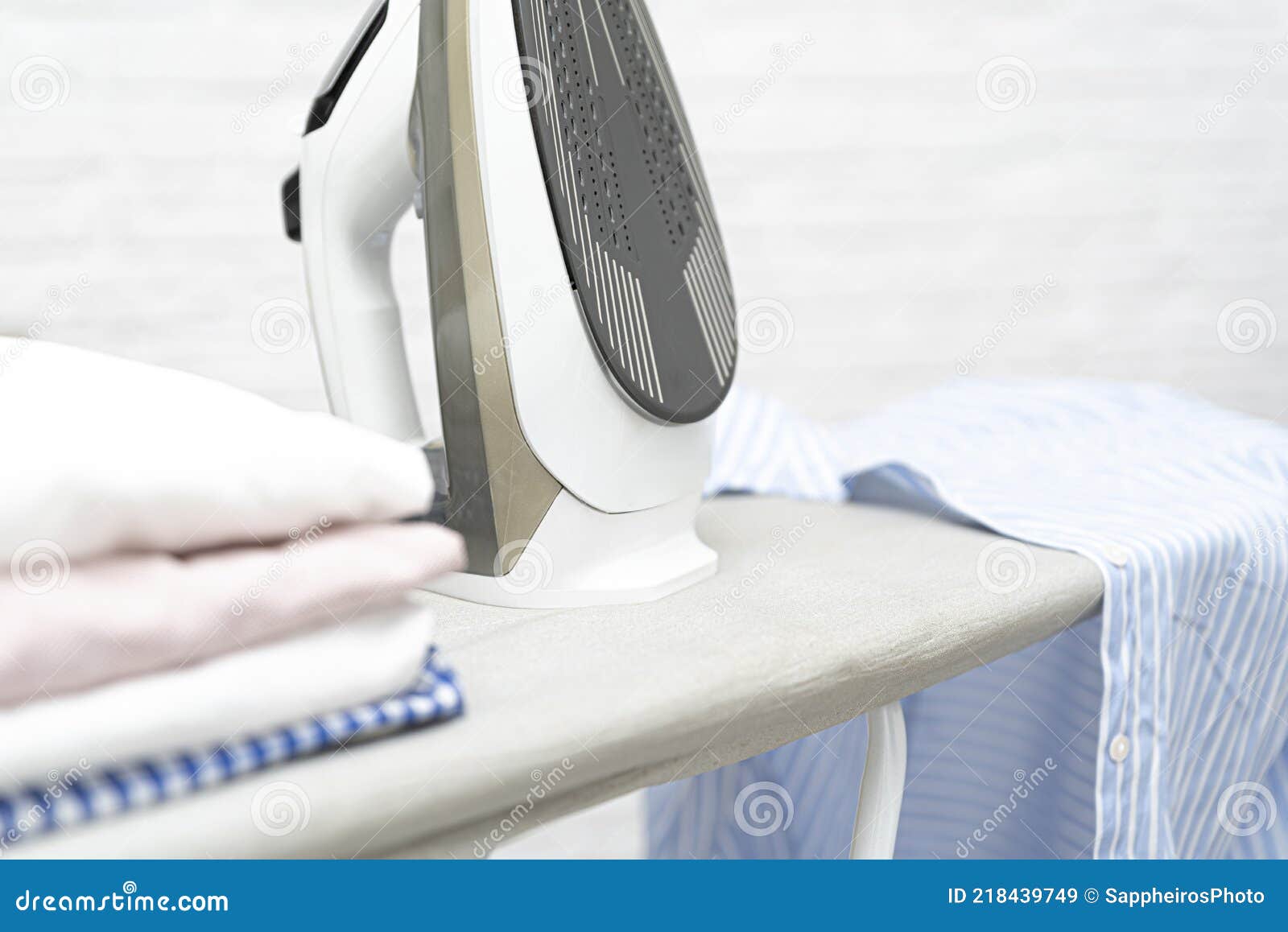 Close Up of Iron Standing on Ironing Board Stock Image - Image of ...