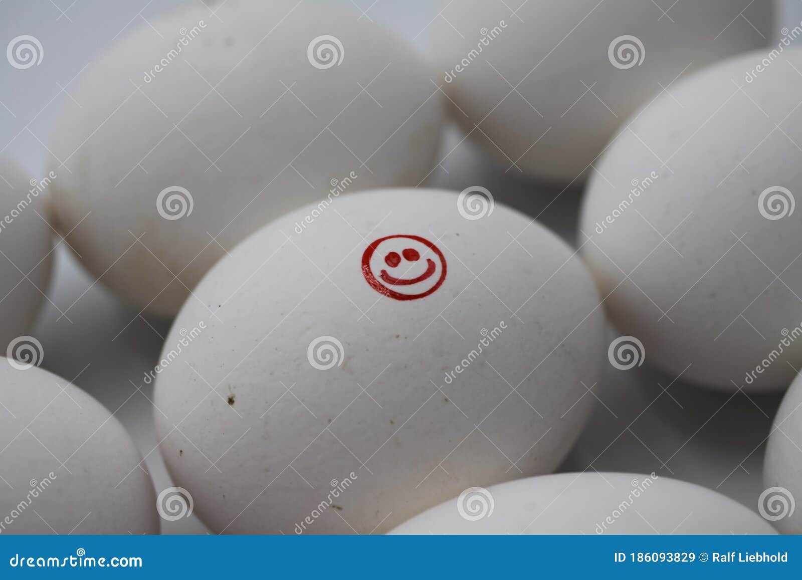 Close Up of Isolated White Raw Egg with Painting of Red Smiling Face ...