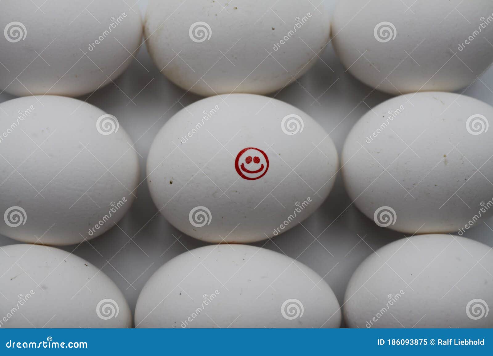 Close Up of Isolated White Raw Egg with Painting of Red Smiling Face ...