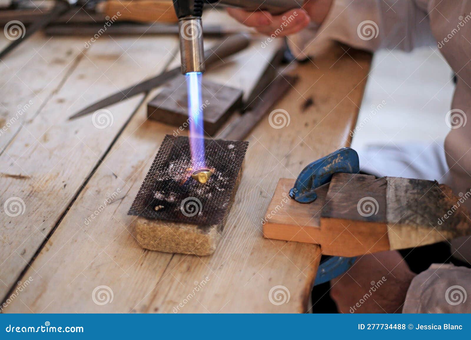 Jeweler making a gold ring stock photo. Image of hand - 277734488