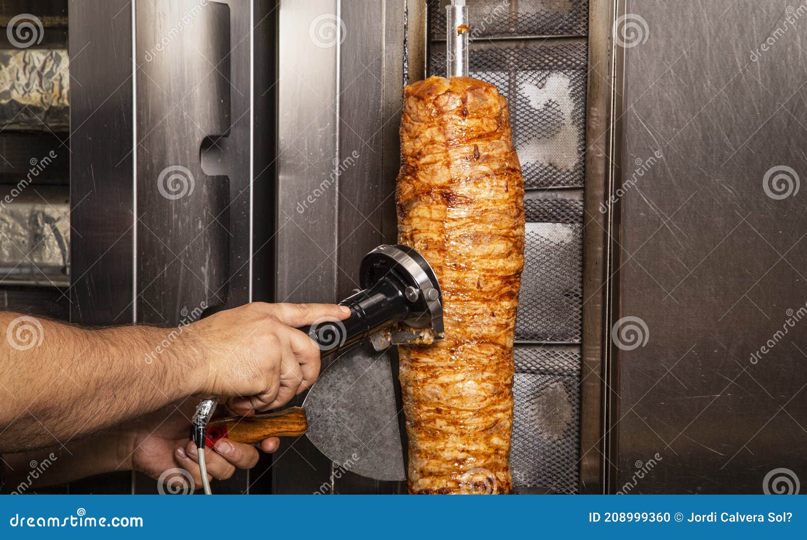 Close-up of Kebab and a Hand Slices the Meat with Slicer Stock Photo ...