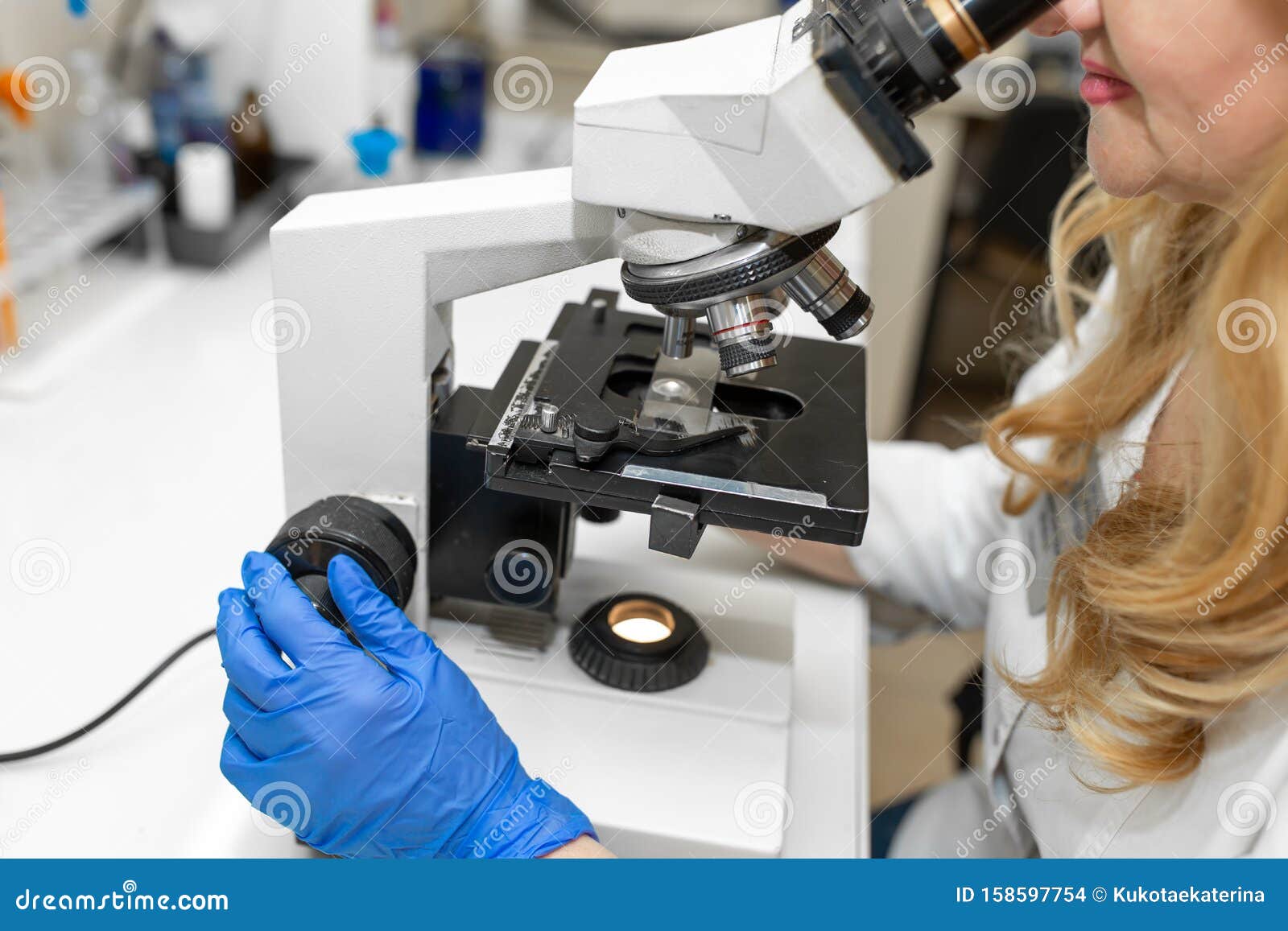 Close Up Lab Technician Research Blood Sample in Microscope Stock Photo ...