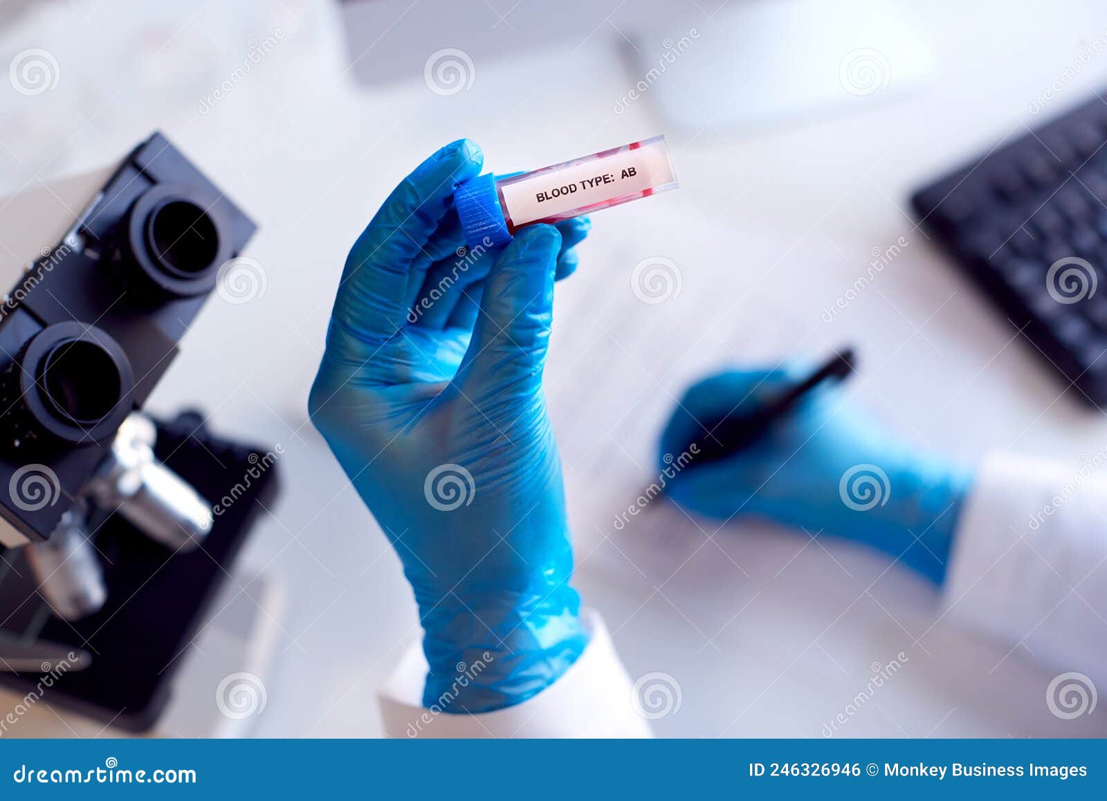 Close Up of Lab Worker Conducting Research Using Microscope Holding ...