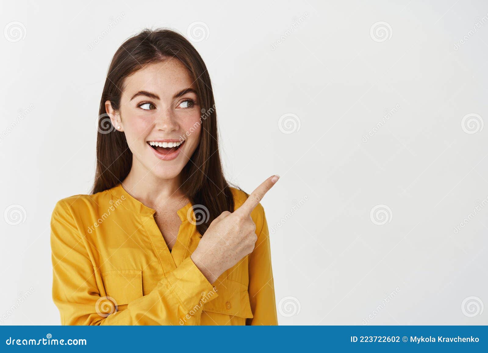 Close Up Of Lady Smiling Pointing And Looking Right With Surprised