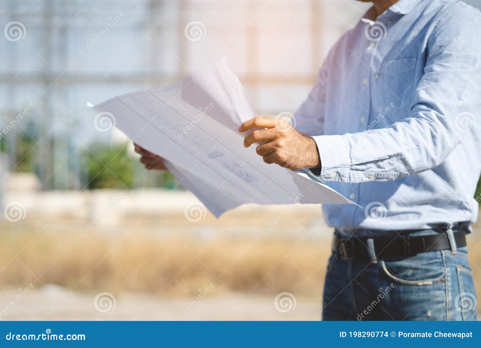 Close Up Land Inspector Checking Blueprint for Industry Construction ...