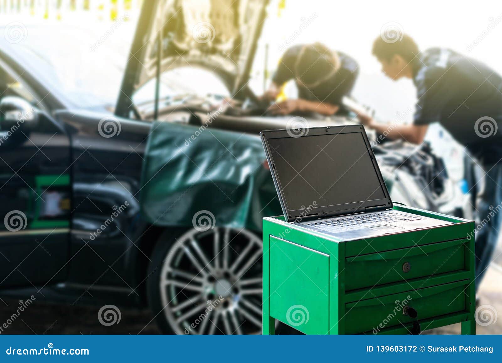 Close Up Laptop or Computer Notebook Interfaced with Car for Repair ...