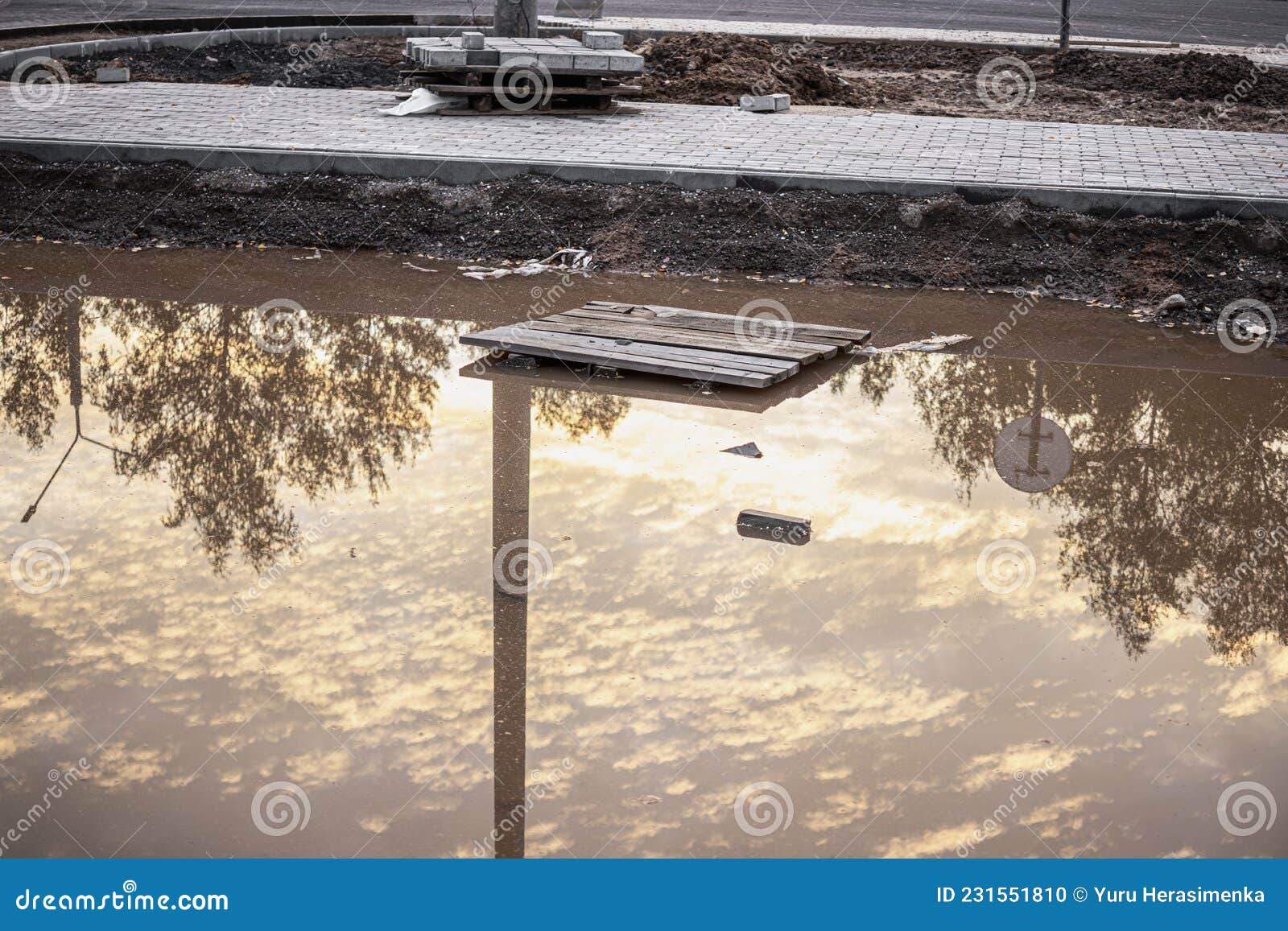 Close-up of a Large Puddle after the Rain at a Construction Site with a ...