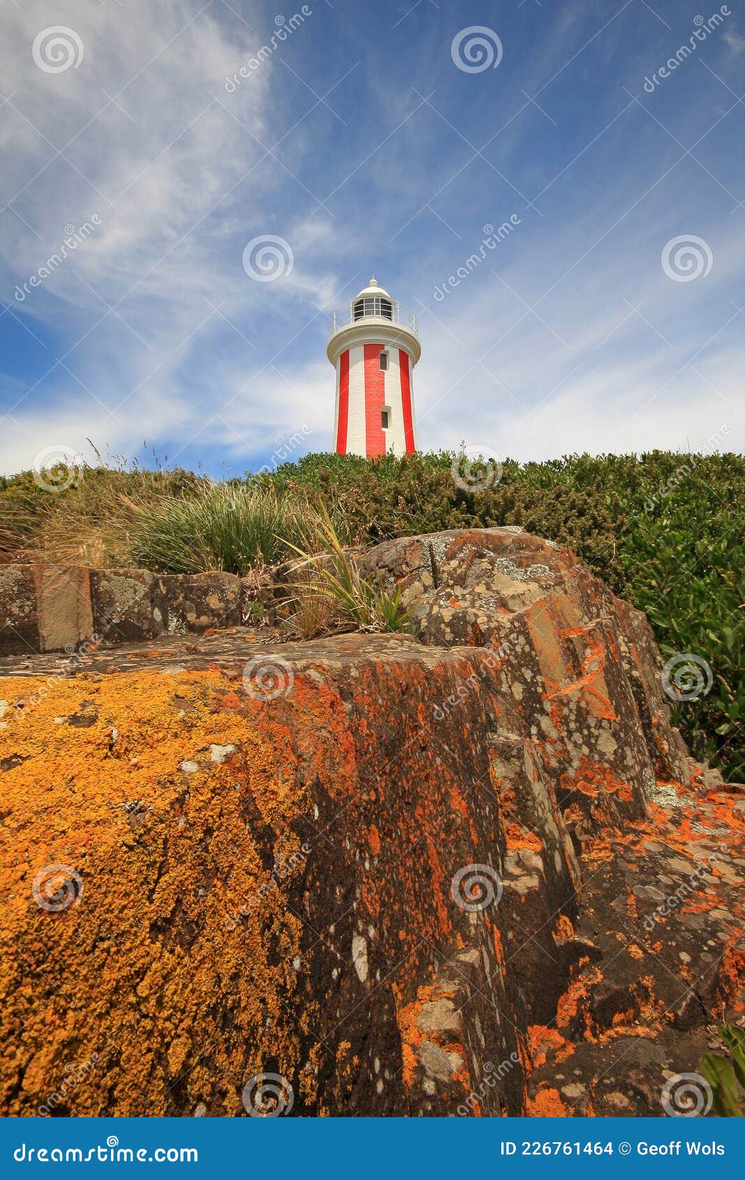 A Close Up of a Large Rock and Lighthouse in Australia Stock Photo ...