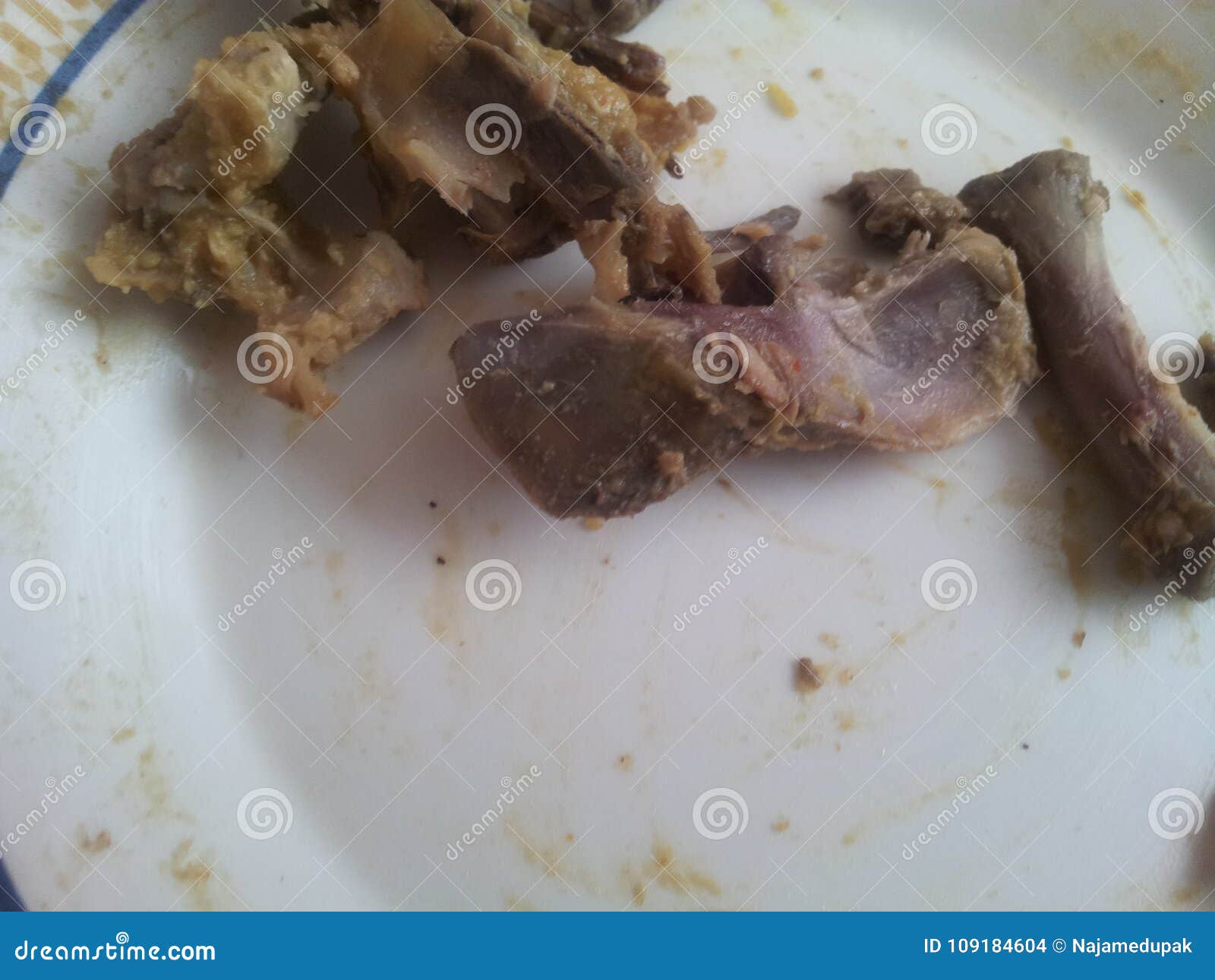 Leftover Chicken Bones in a White Ceramic Plate Stock Photo - Image of ...