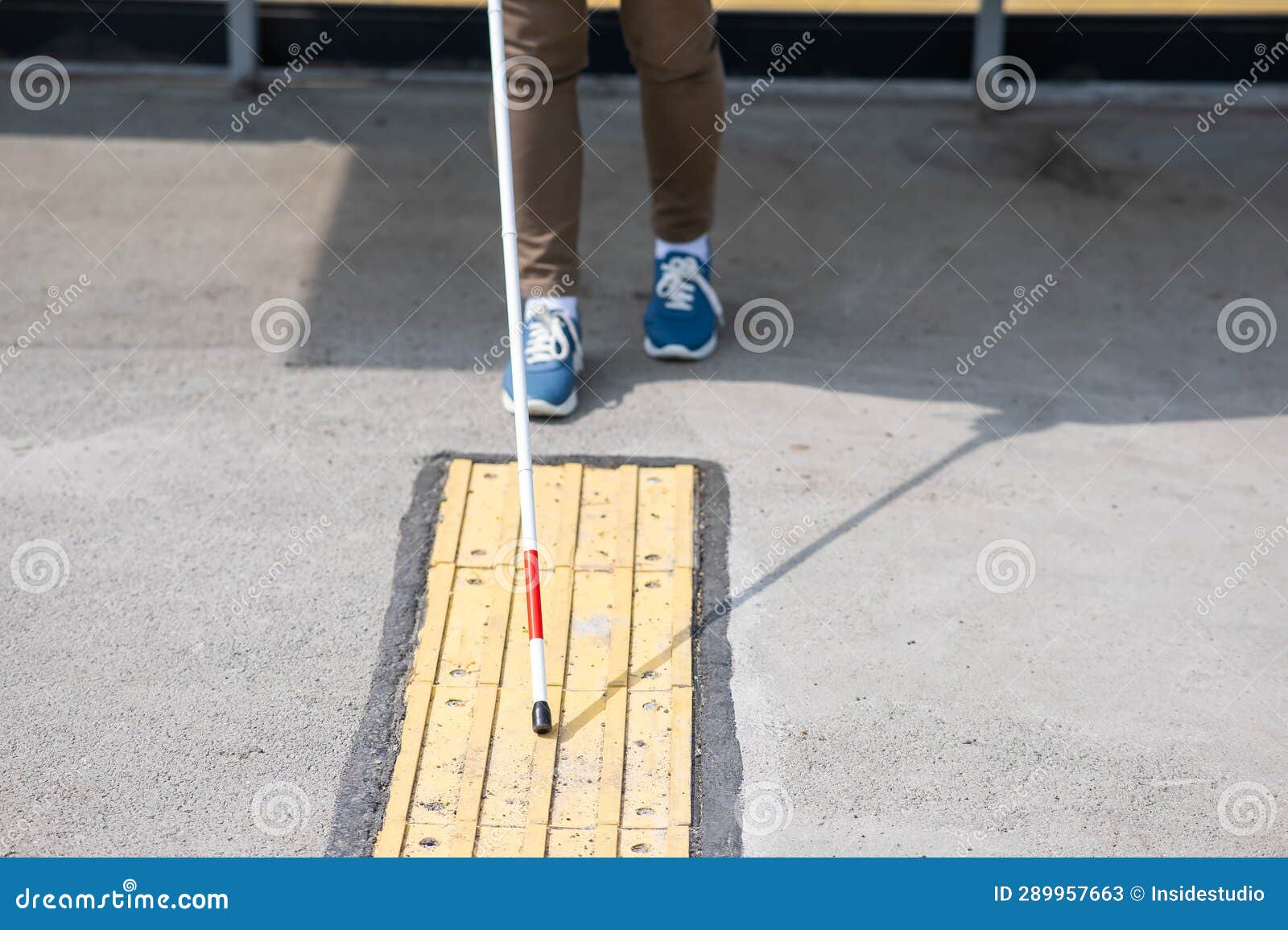 Close-up of the Legs of a Blind Woman at a Bus Stop. Stock Image ...