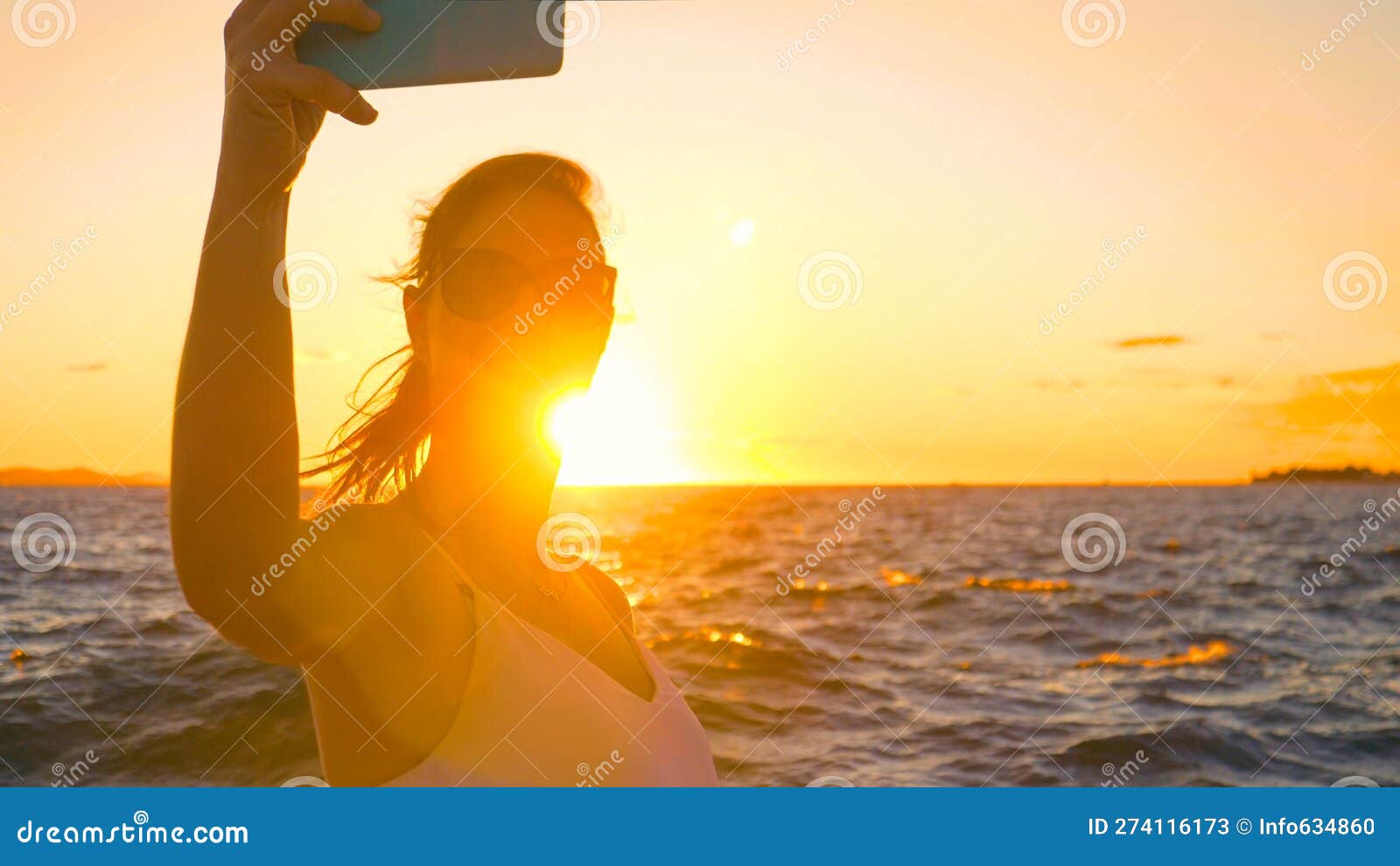 Close Up Young Female Tourist Takes Selfies In Front Of The Sea At