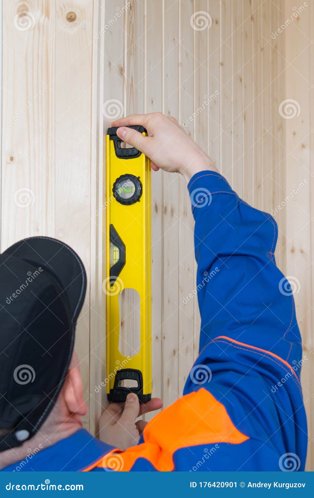 Close-up of a Level for Leveling a Wooden Surface in the Hands of a ...