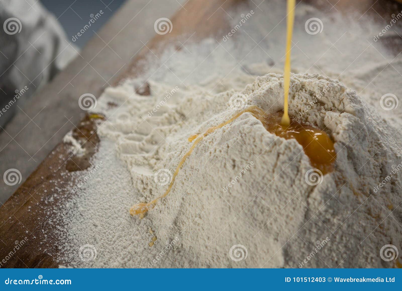 Liquid egg poured on flour stock image. Image of homemade - 101512403