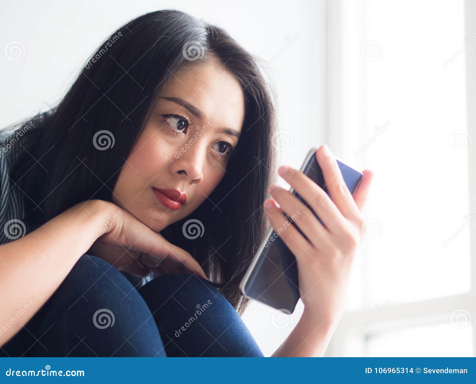 Lonely Asian Woman Using Smartphone in the Room. Stock Photo - Image of ...