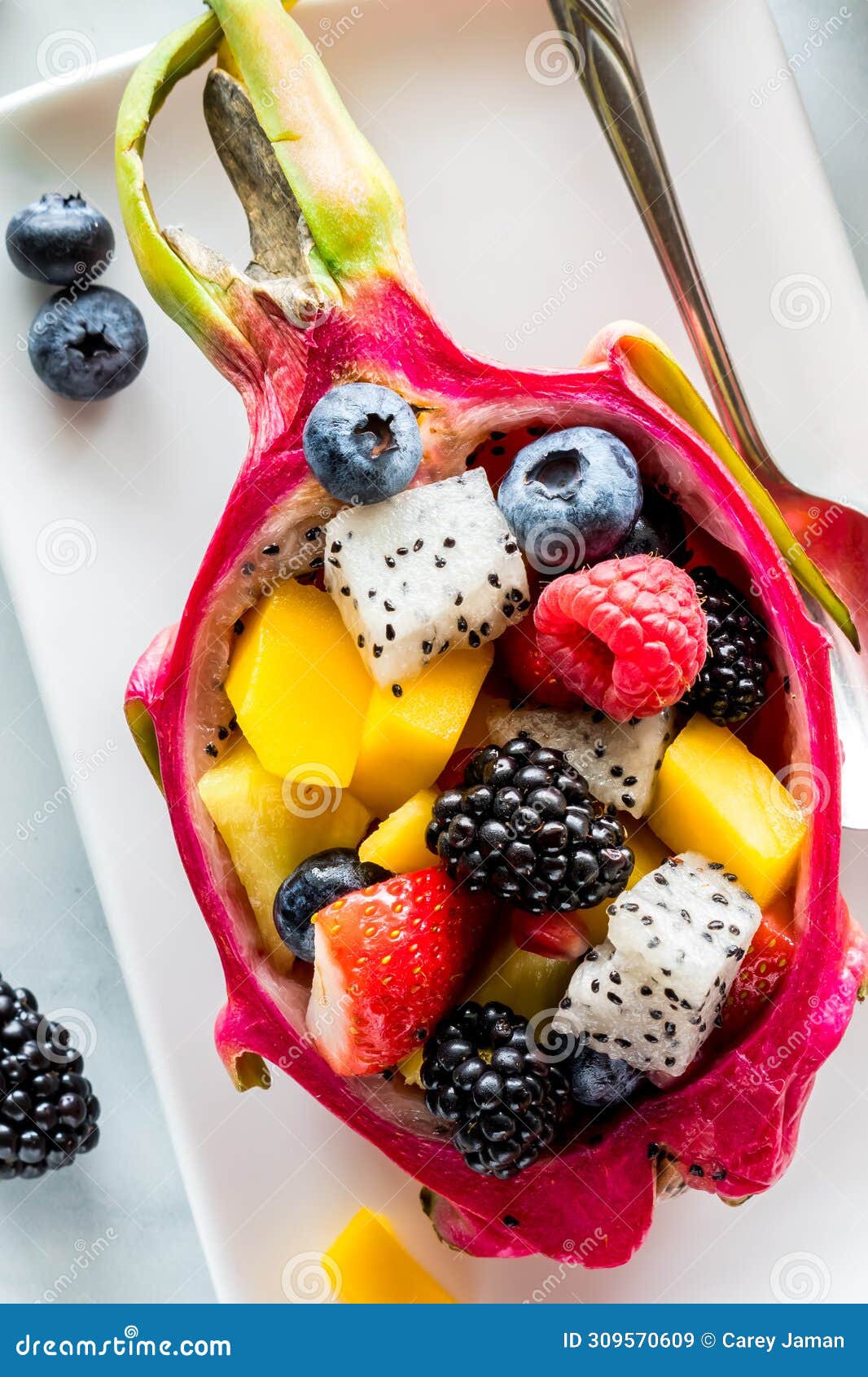 A Close Up Look into a Fruit Salad in a Dragon Fruit Shell, Ready for ...