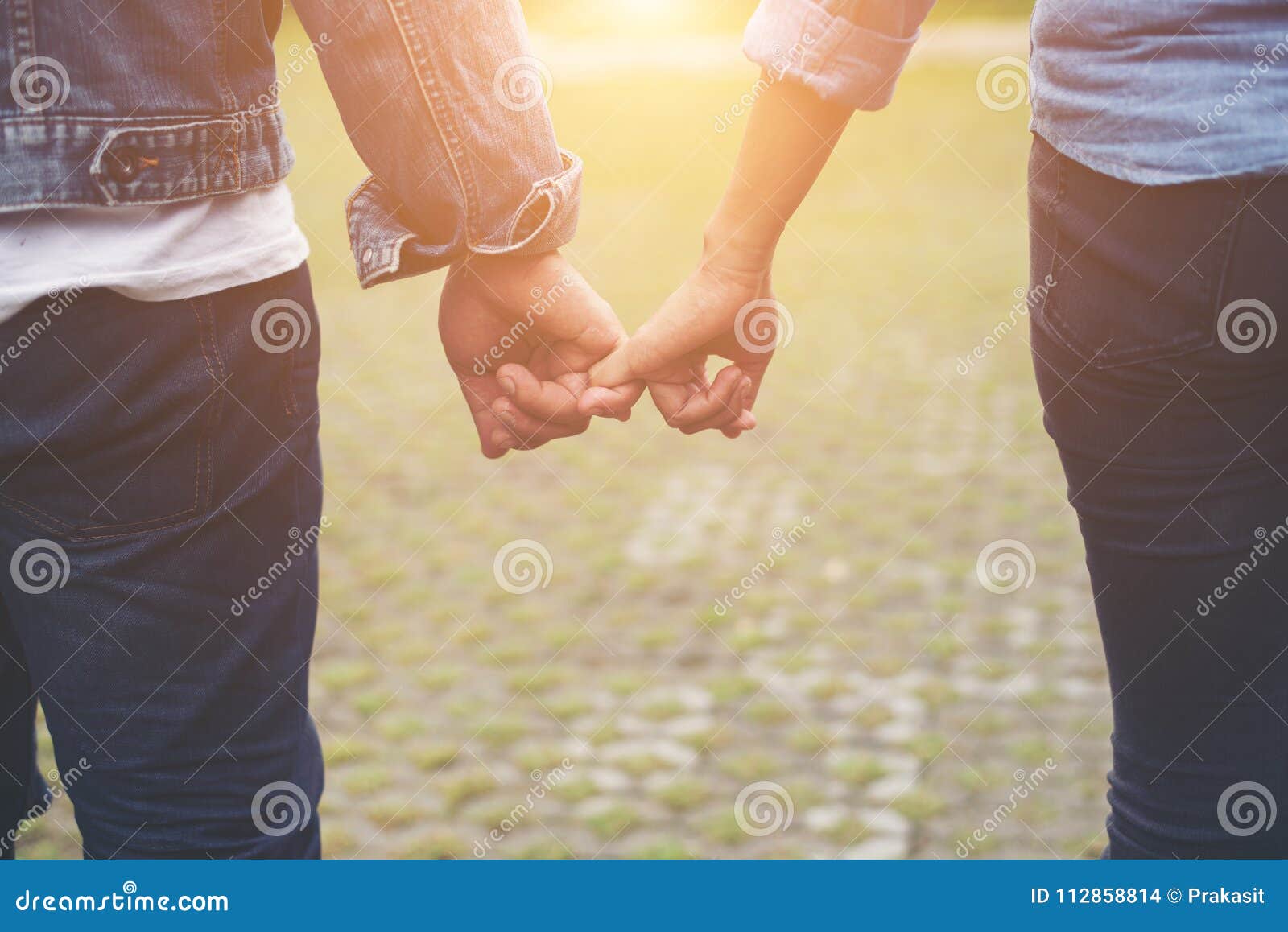 Close Up Of Loving Couple Holding Hands While Walking Outdoor C Stock