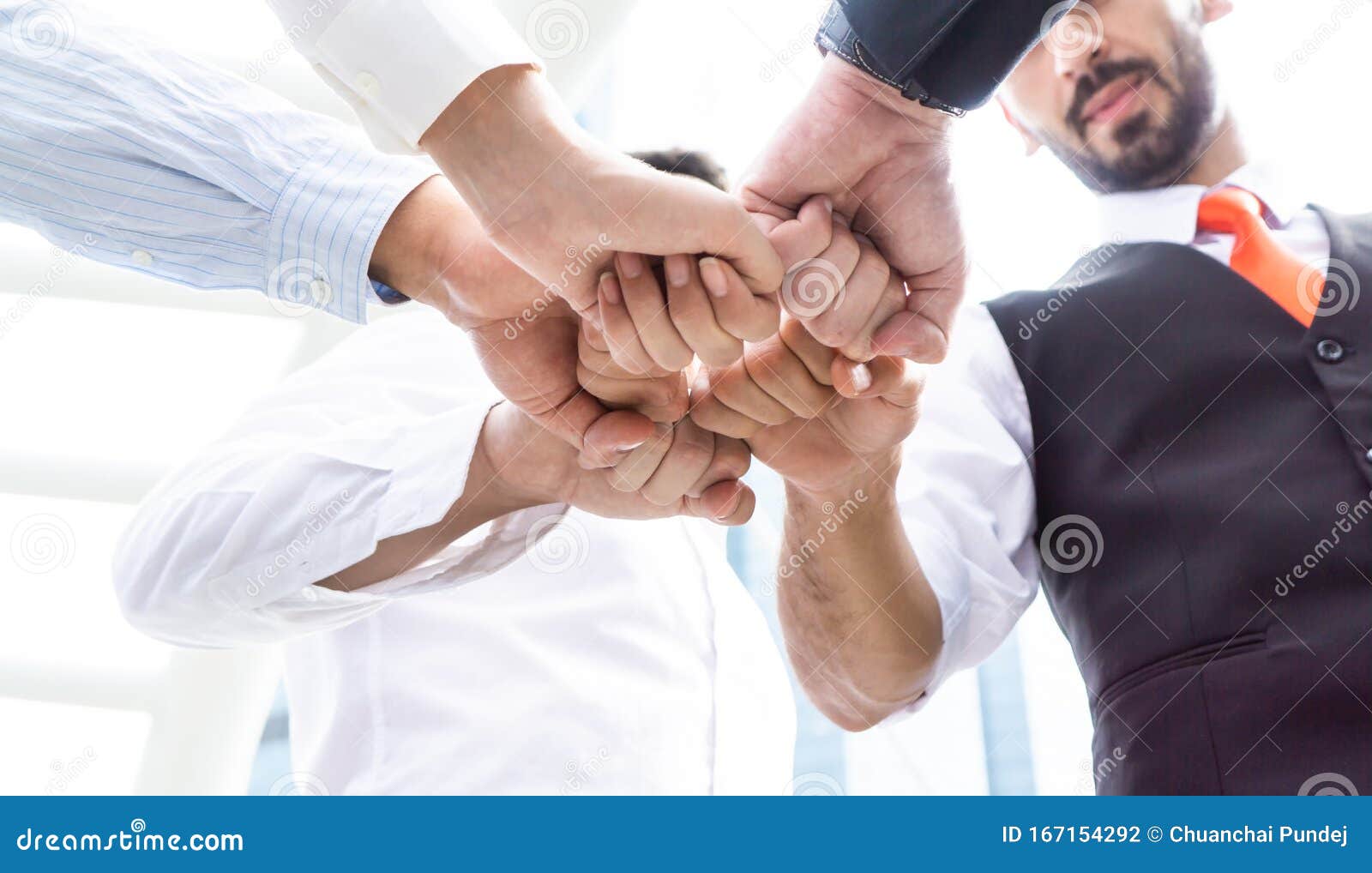 Close Up Low Angle View of Young Business People Putting Their Hands ...