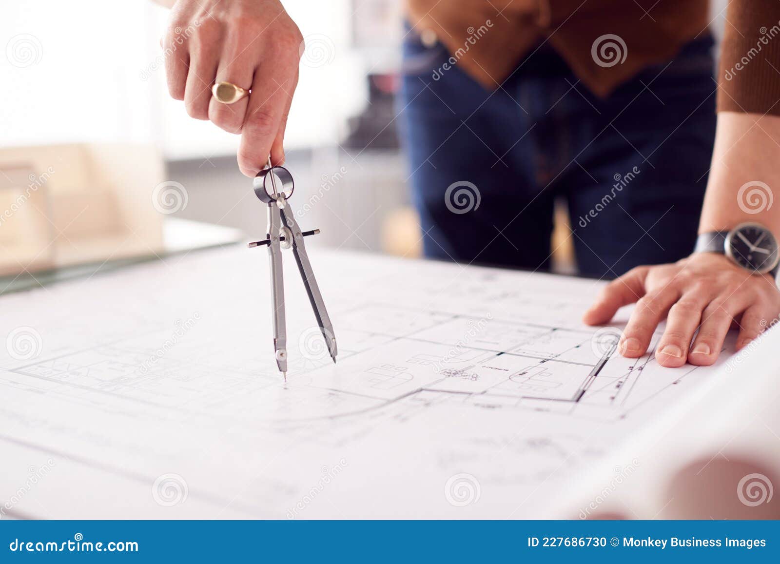 Close Up of Male Architect in Office Measuring Plan or Blueprint Using ...
