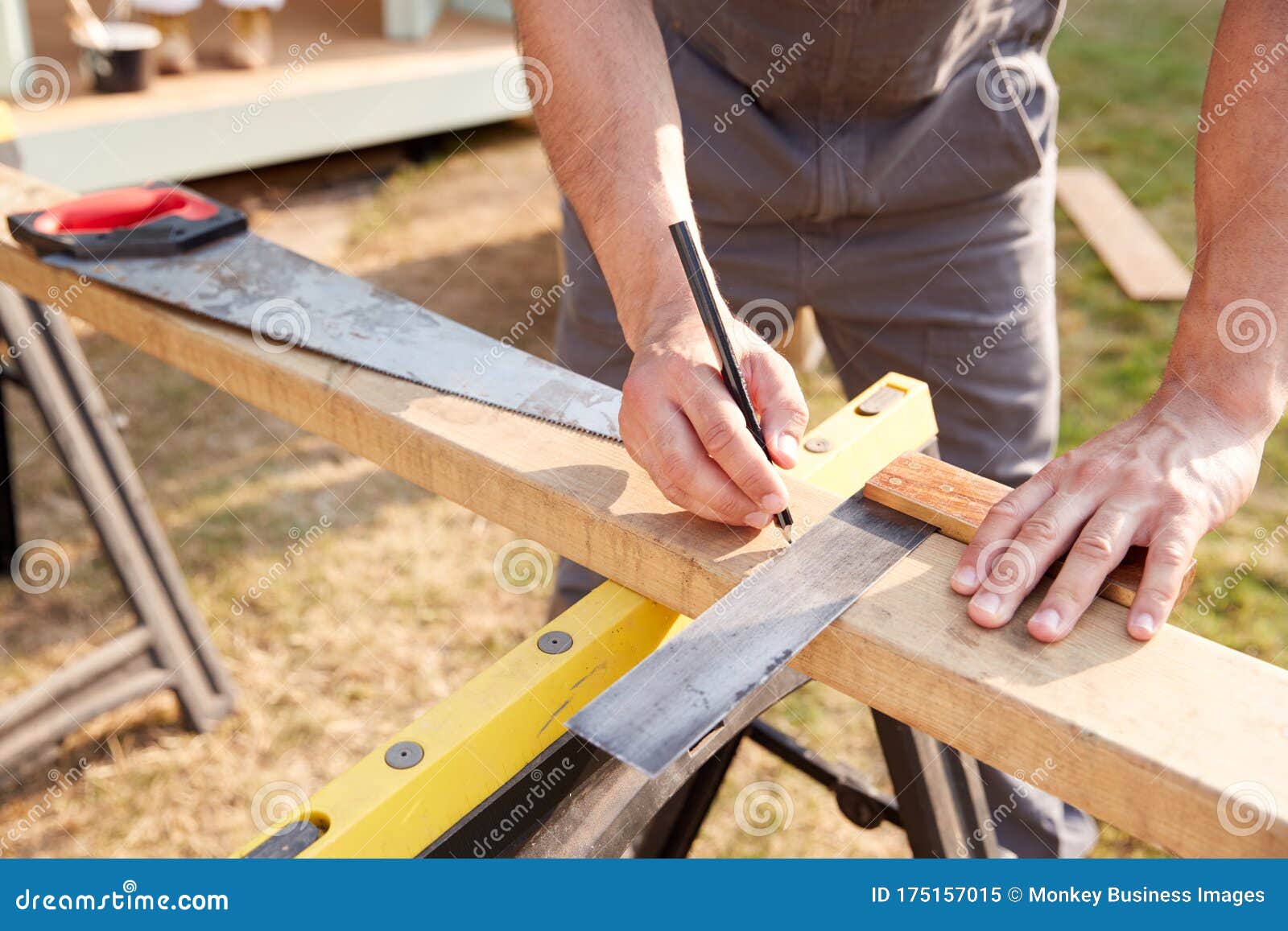 Close Up Male Carpenter Measuring Wood Using Set Square Outdoors Stock ...