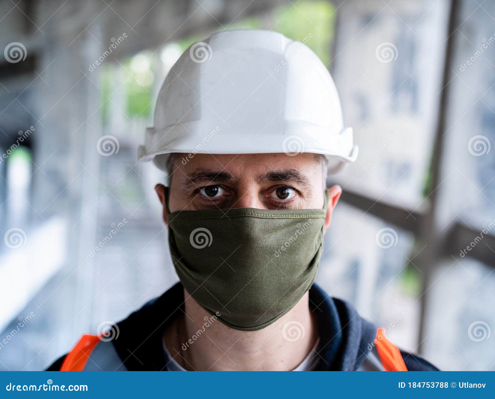 Close-up of a Male Construction Worker in a Construction Helmet and ...