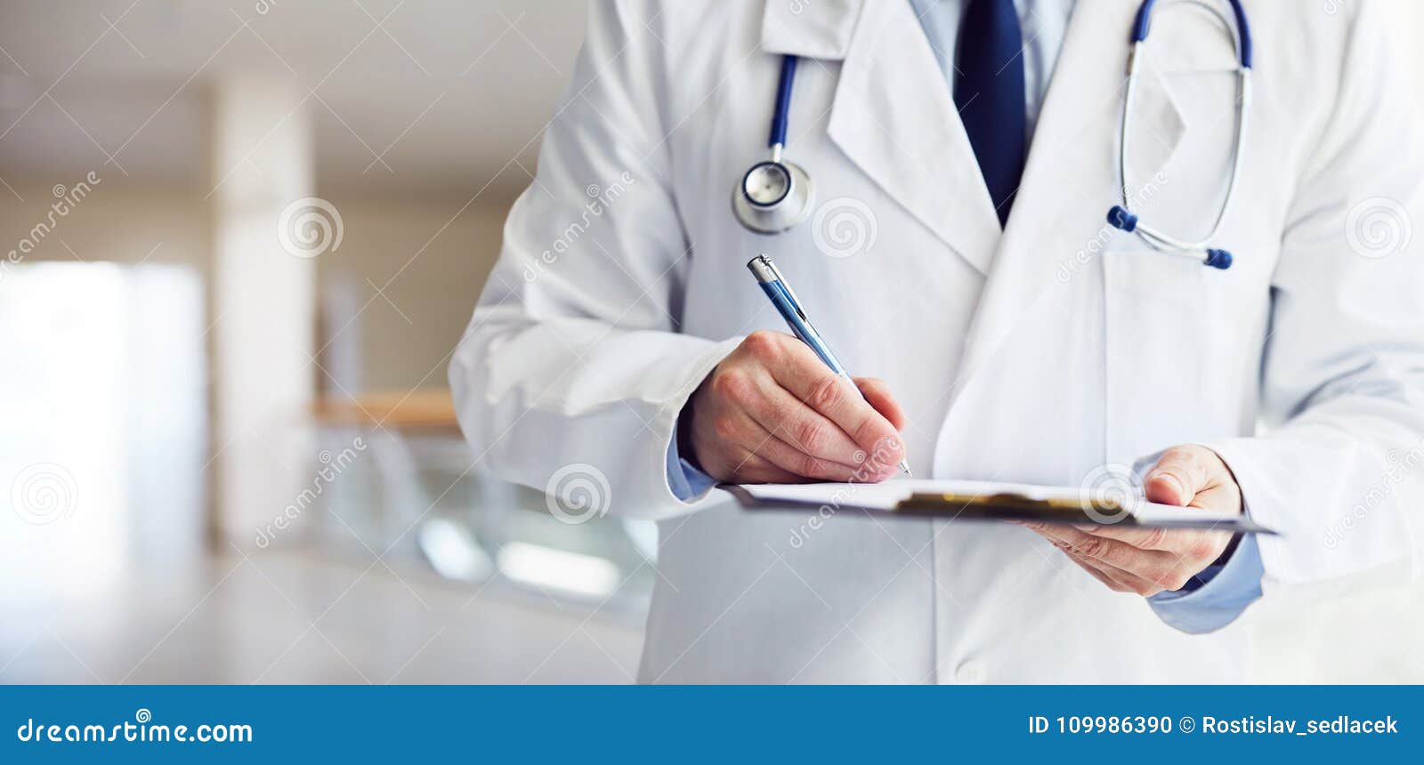 Male Doctor Writing Notes on the Folder Stock Photo - Image of ...