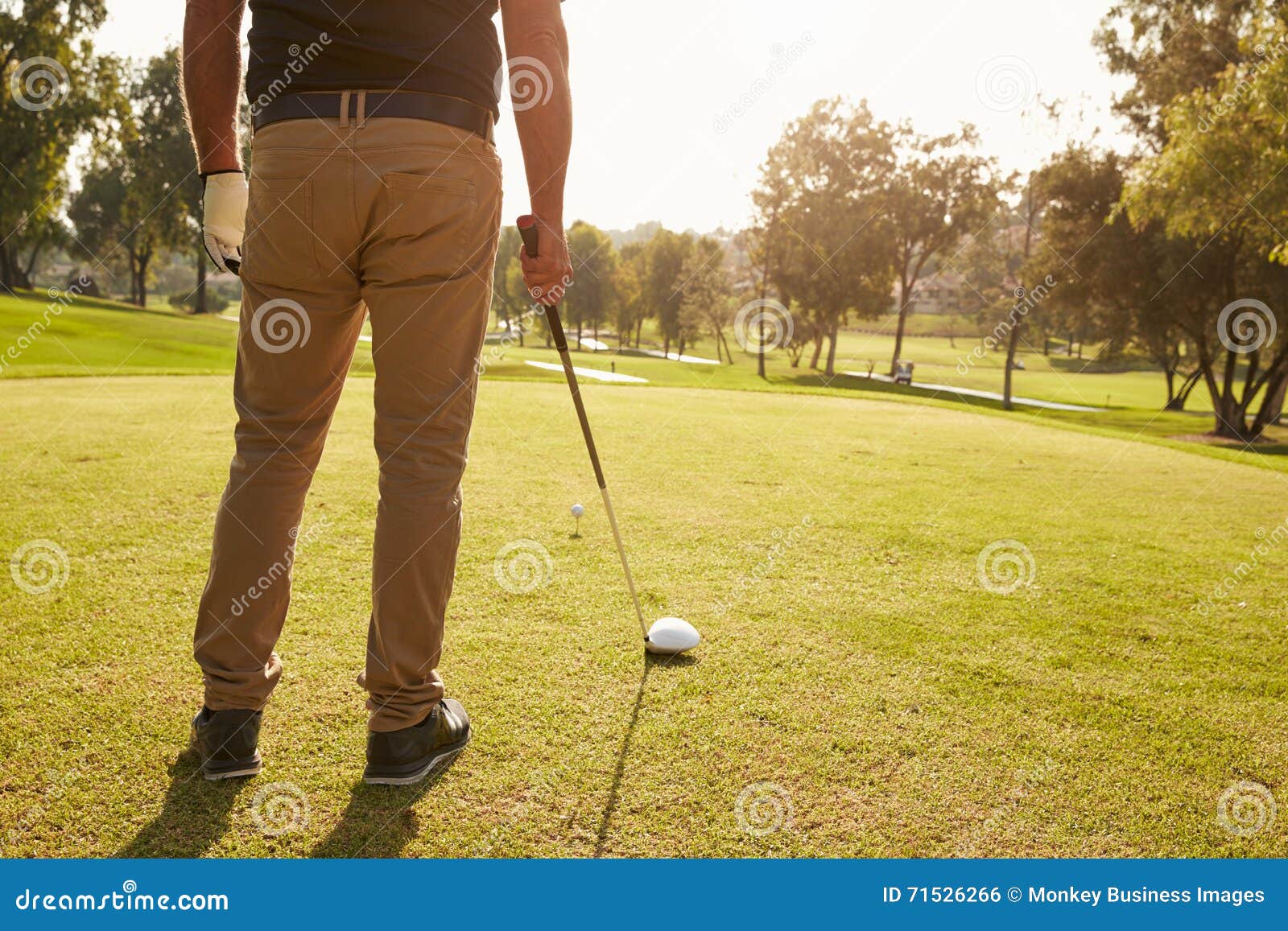 Close Up of Male Golfer Lining Up Tee Shot on Golf Course Stock Photo ...