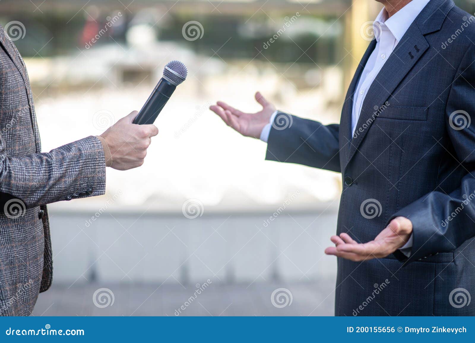 Close-up of Male Hands Holding Microphone during Interview Stock Photo ...
