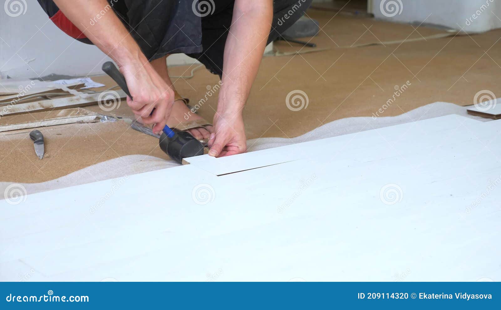 Close-up. Male Hands Install White Laminate Indoors Stock Photo - Image ...