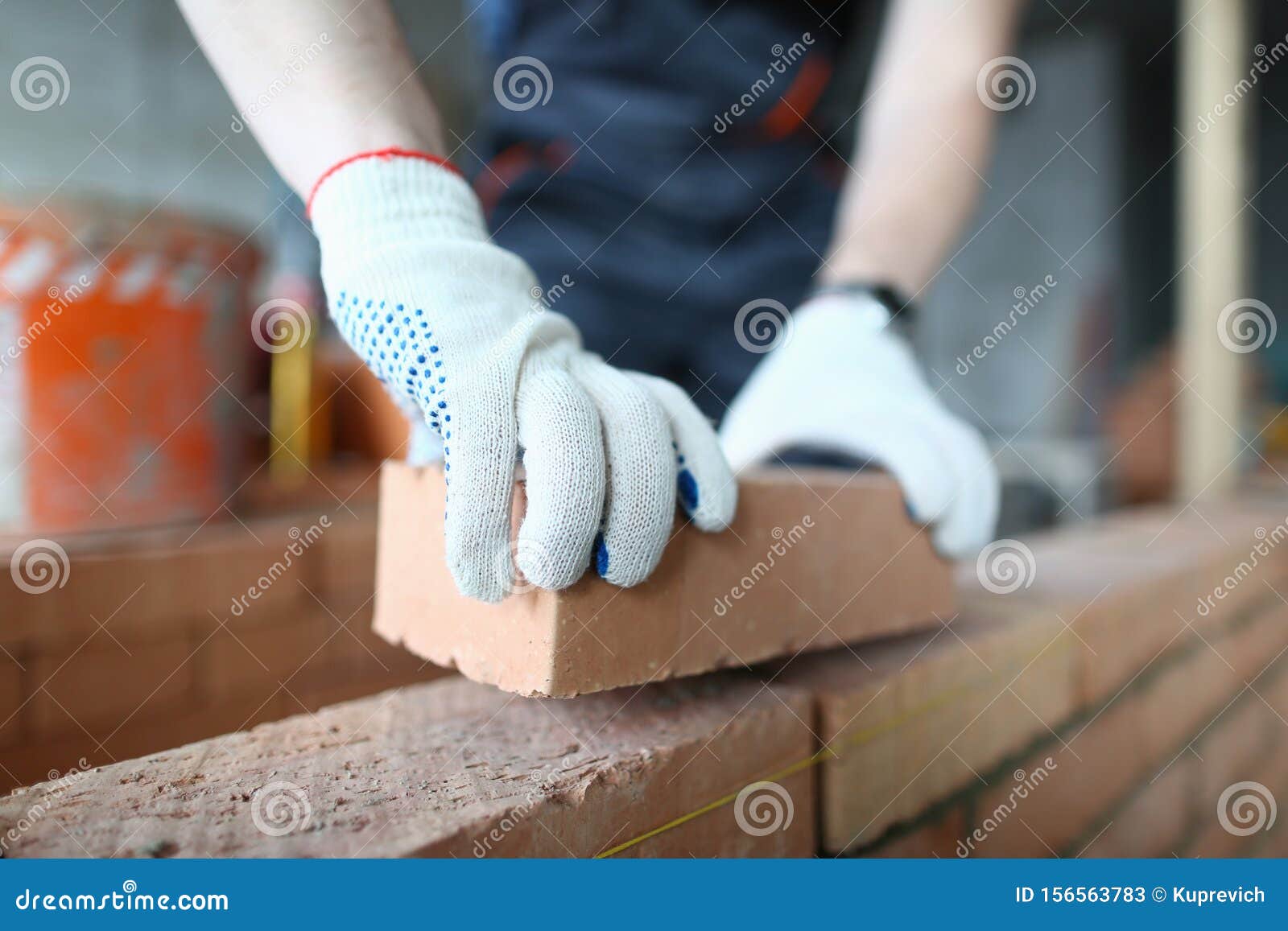 Man laying bricks stock image. Image of mans, gloves - 156563783