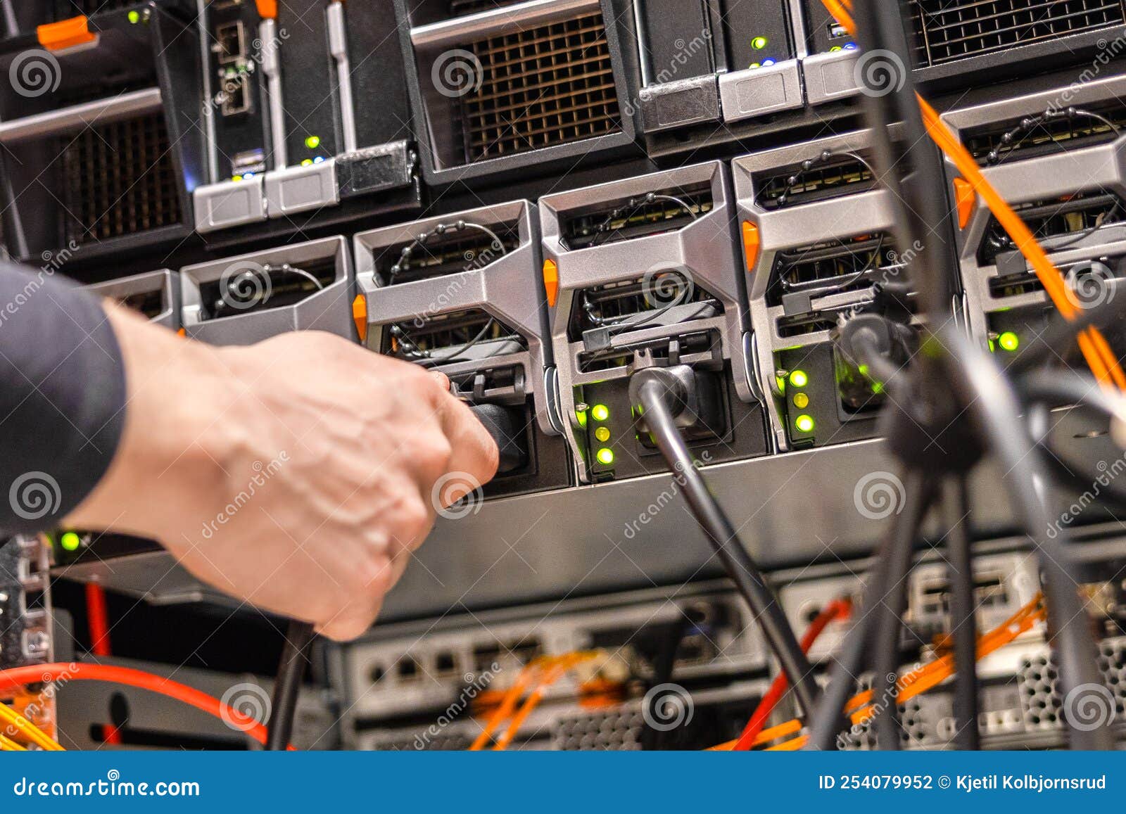 Close-up of Male Technician Plugging Computer Cable in San Stock Photo ...
