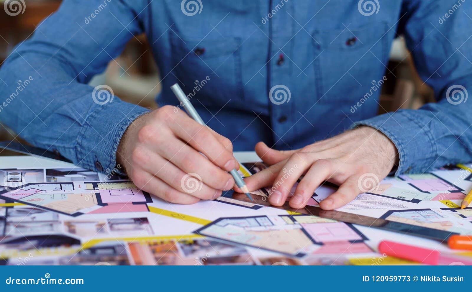 Close-up: the Man Bends Over the Desk and Makes Notes with a Pen ...