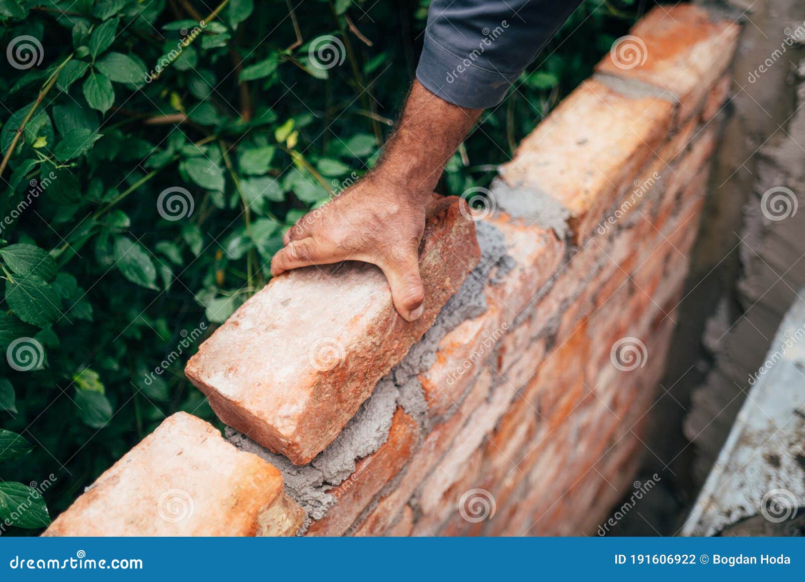 Close Up Of Bricklayer Builder Using Cement Mortar To Put The ...