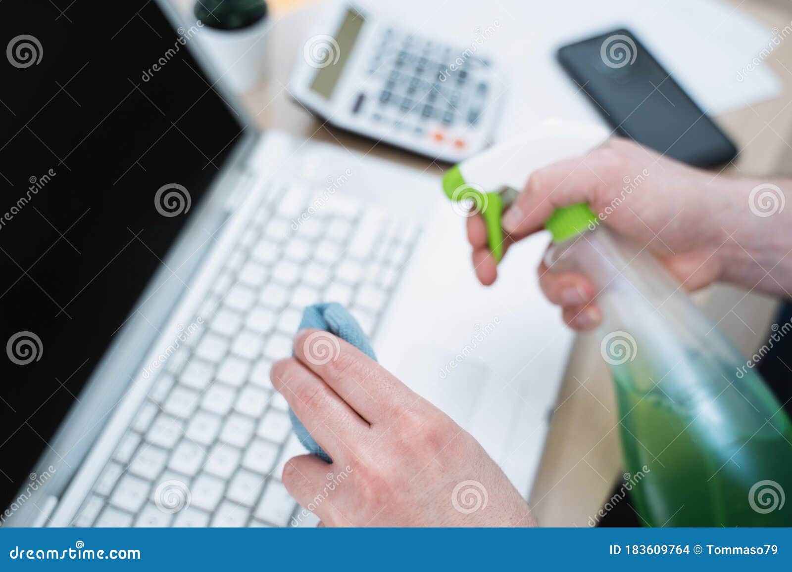Close Up of Man Cleaning and Sanitizing Tech Devices Stock Photo ...