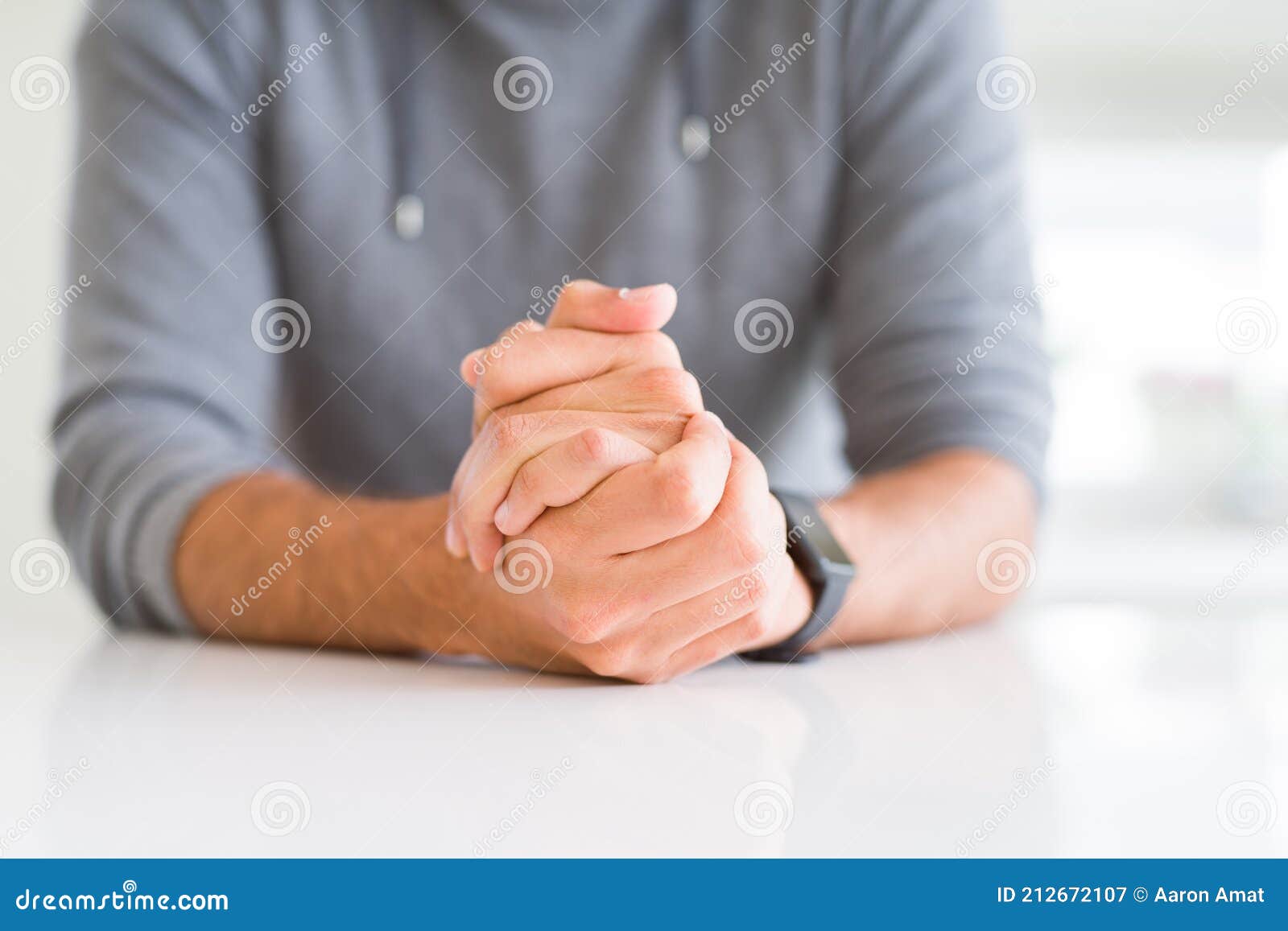 Close Up of Man with Crossed Hands Over White Table Stock Image - Image ...