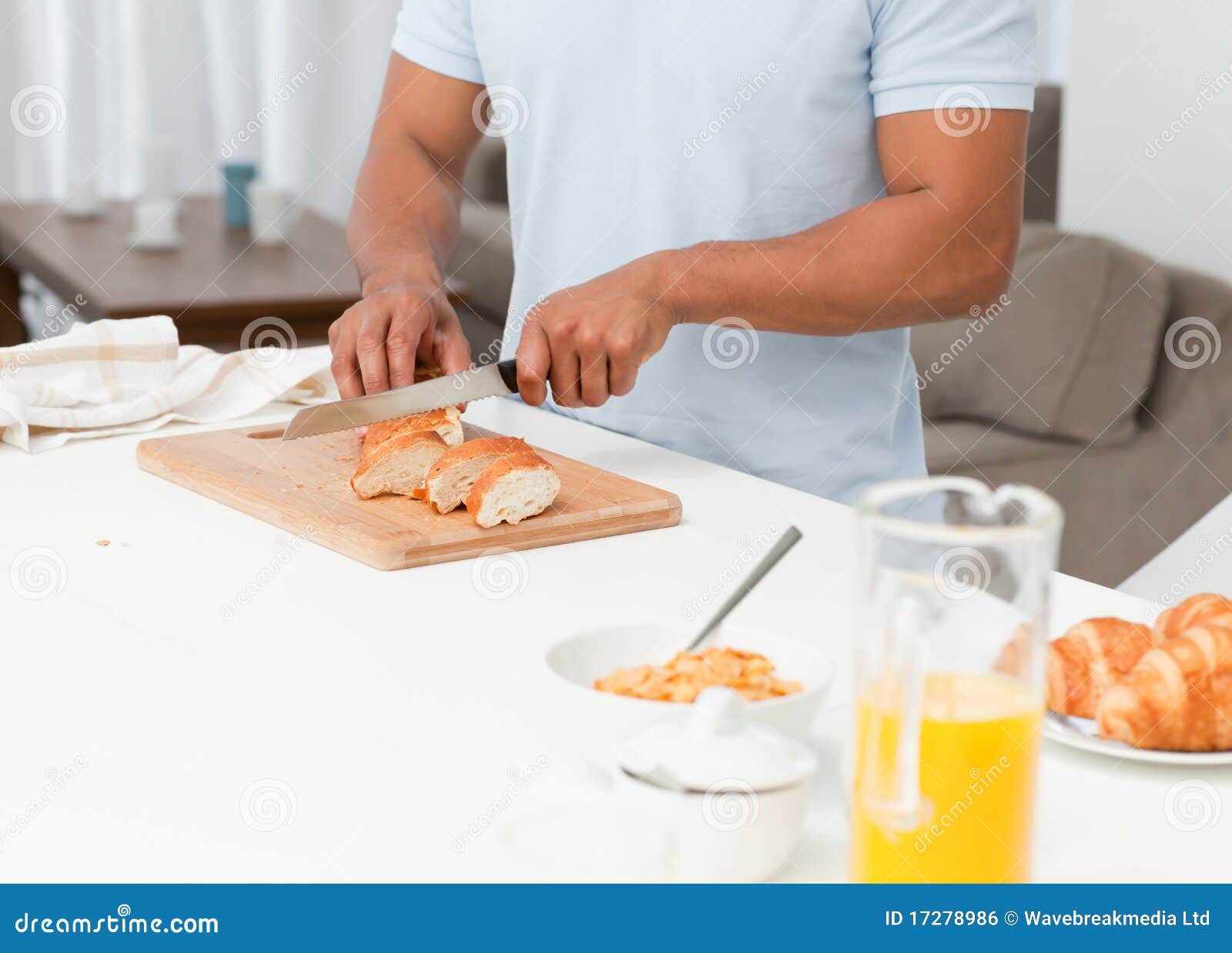 Close Up of a Man Cutting Bread during Breakfast Stock Photo - Image of ...