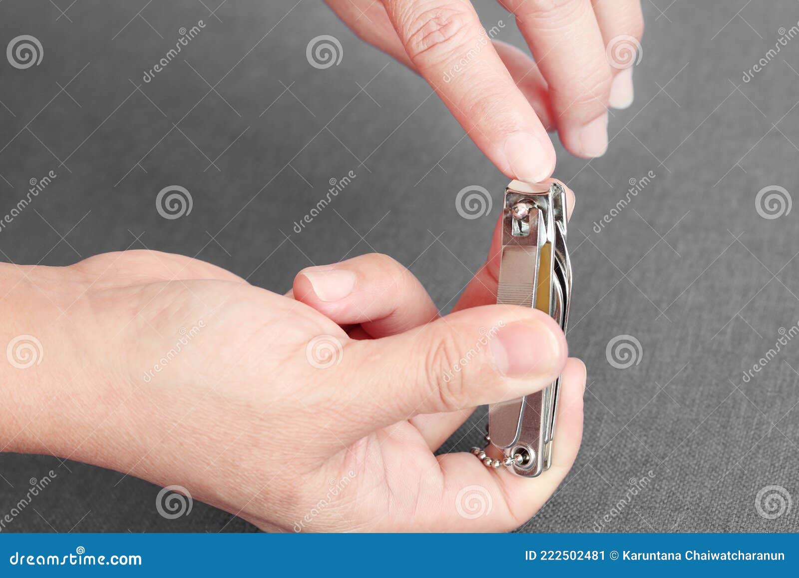 Close Up of Man Cutting Fingernails Using Nail Clipper Stock Image ...