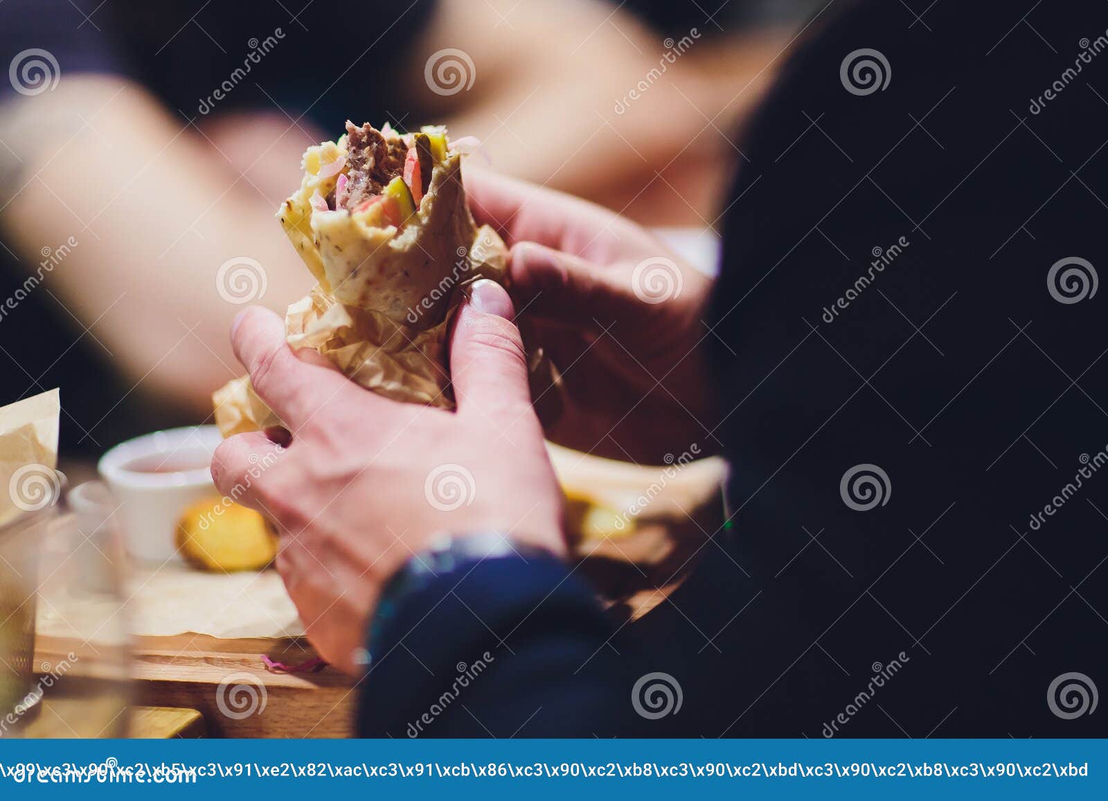 Close-up of Man Eating Doner Kebab Hand. Stock Photo - Image of lunch ...