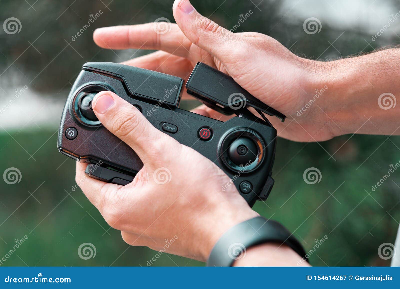 Close Up of Man Folding Drone Quadcopter Joystick Controller at Park ...