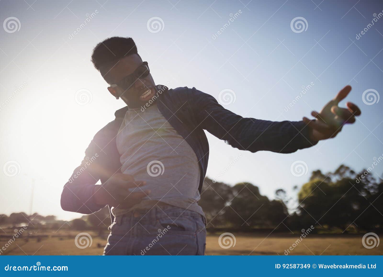 Close Up of Man Gesturing while Standing on Field Stock Image - Image ...