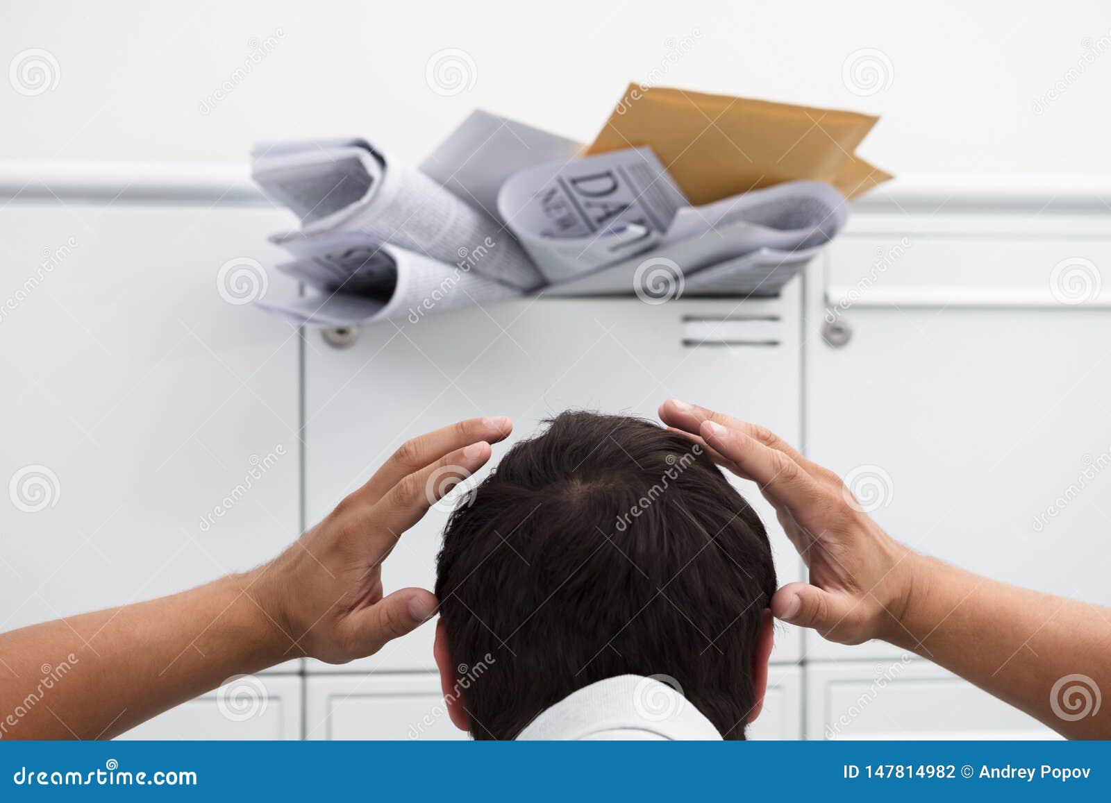 Man with Hand on Head in Front of Overloaded Mailbox Stock Photo ...