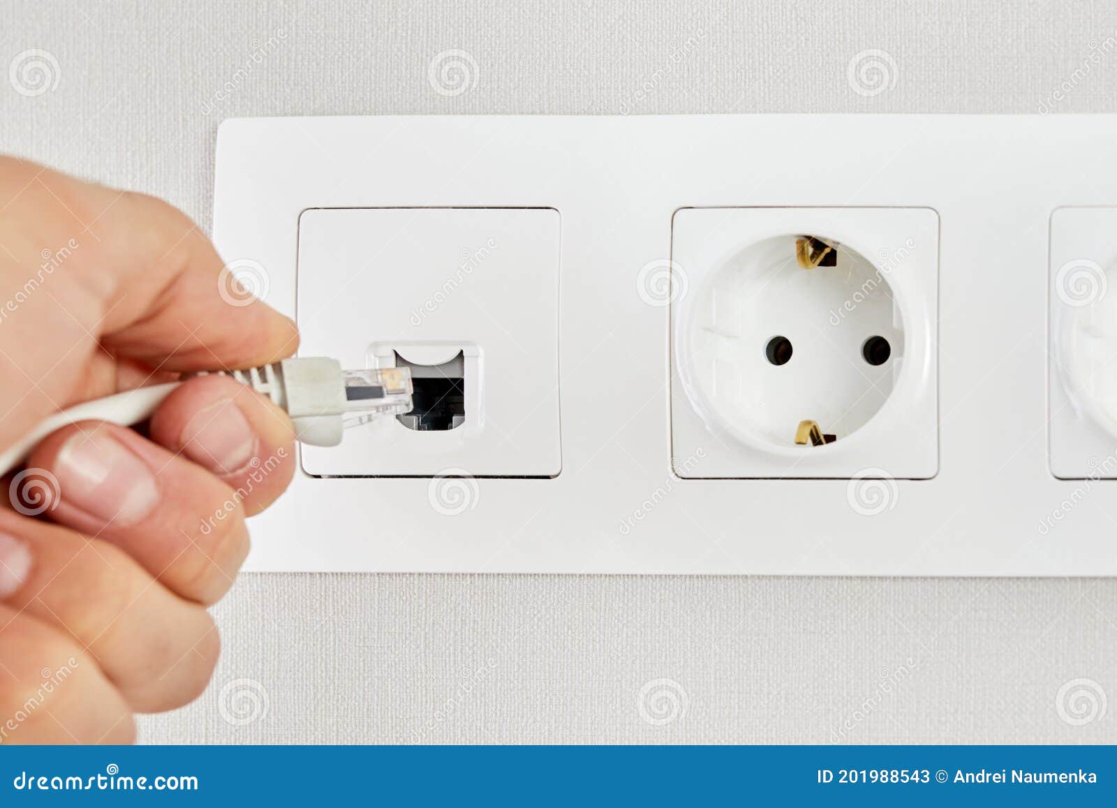 Close Up of a Man Hand Plugging an Ethernet Cable into a Wall Socket ...