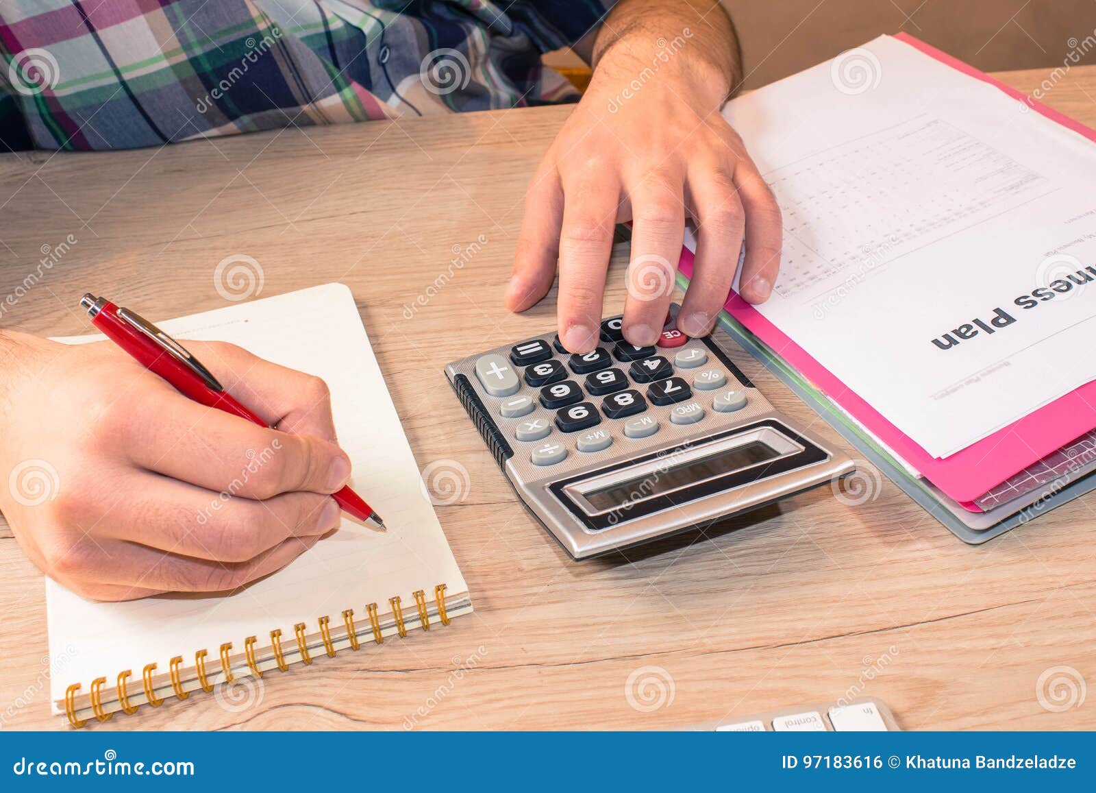 Close Up Man Hand Using Calculator and Writing Make Note with Ca Stock ...