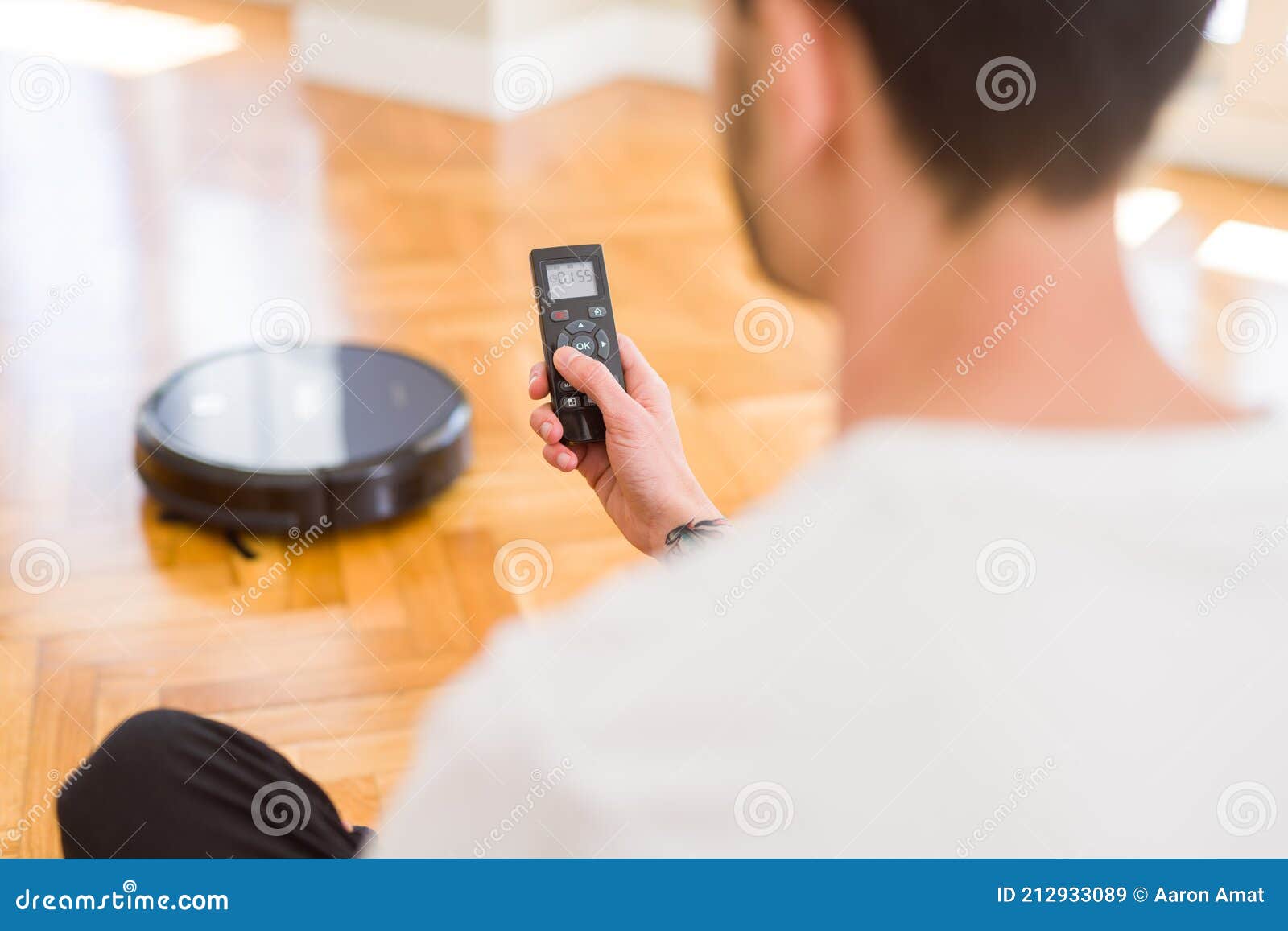 Close Up of Man Hands Controling Automatic Vacuum Cleaner Using ...