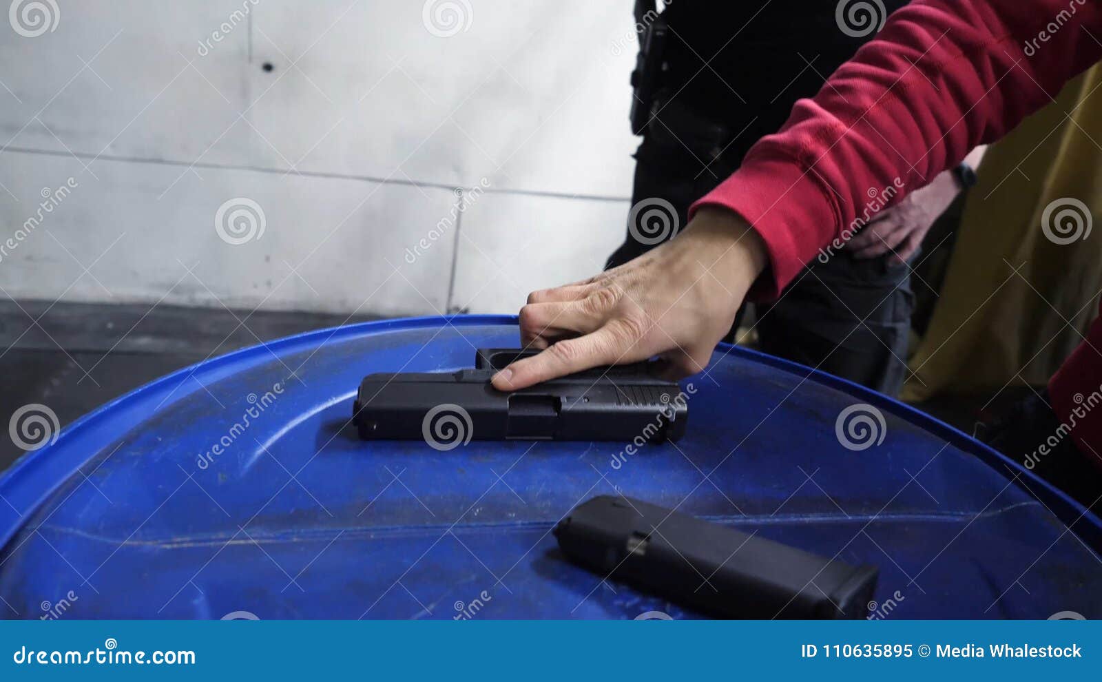 Close-up of a Man Hands Holding and Loading Gun Magazine in the Pistol ...