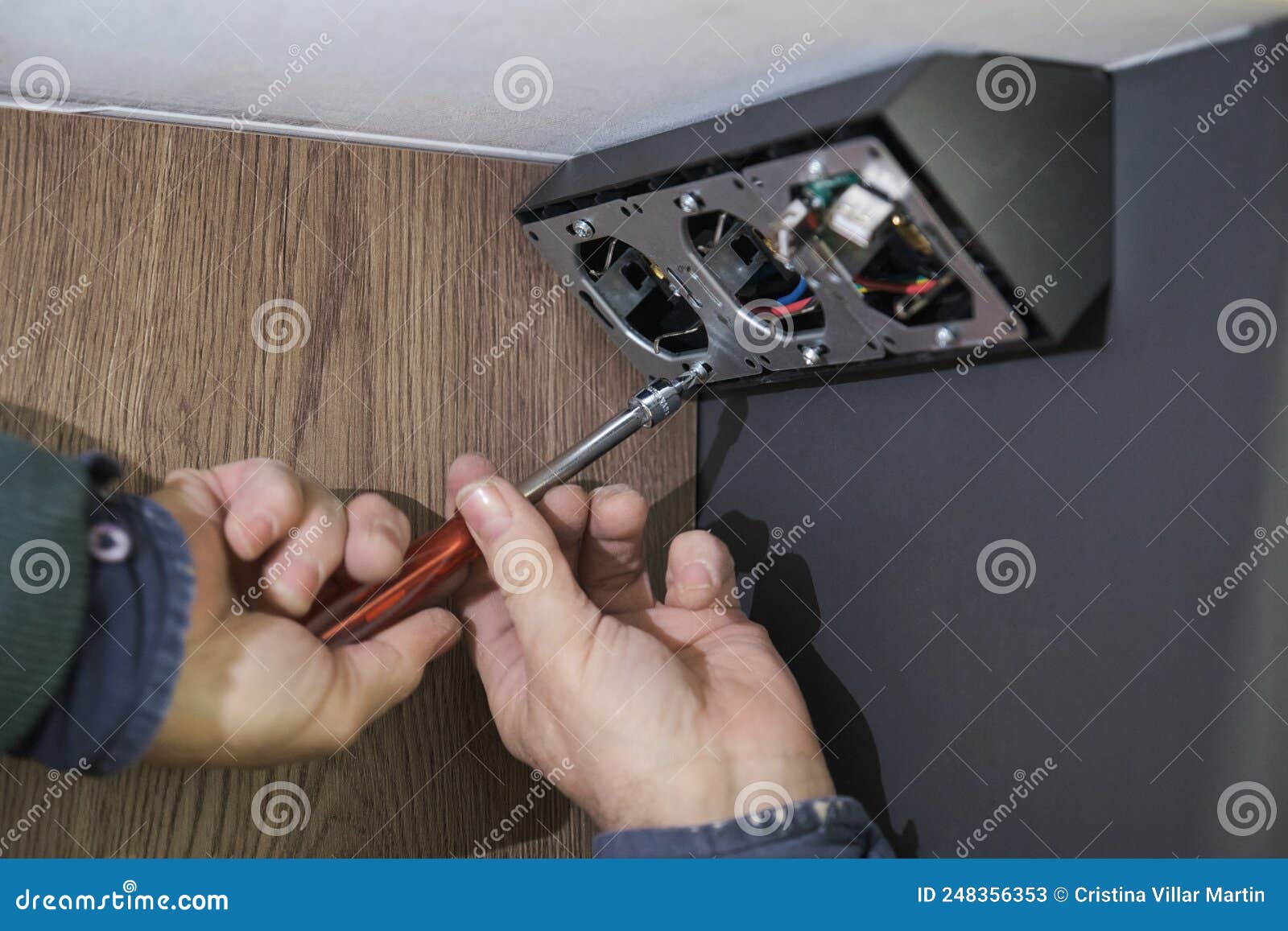 Close Up of a Man Installing Corner Socket with Screwdriver. Stock ...