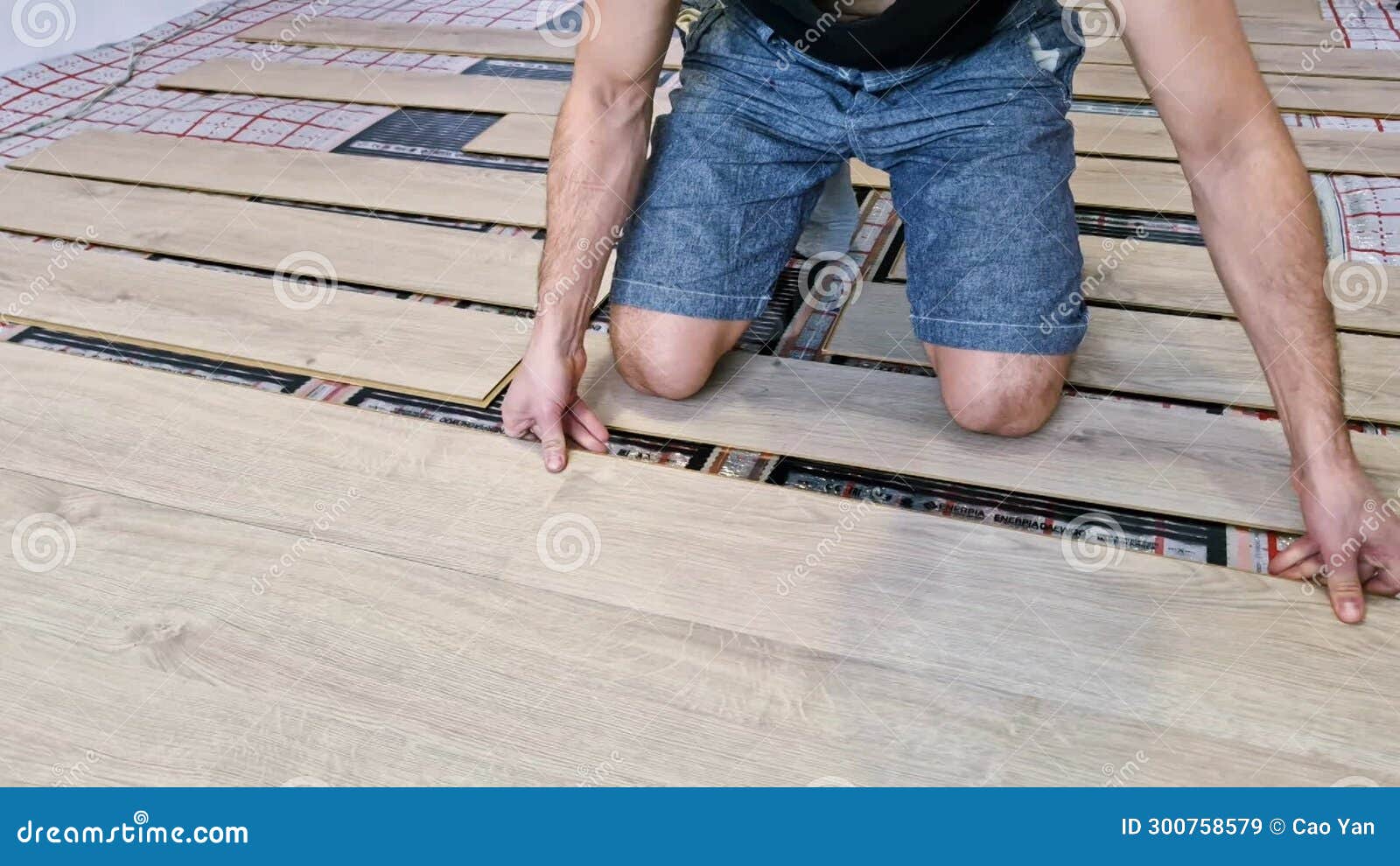 Close Up of Man Installing Underfloor Heating and Building Wooden Floor ...