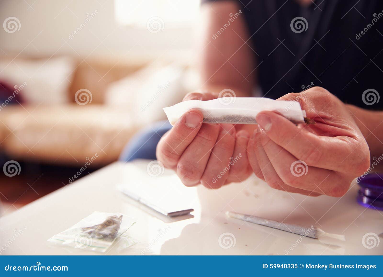 Close Up of Man Rolling Marijuana Joint at Home Stock Image - Image of ...