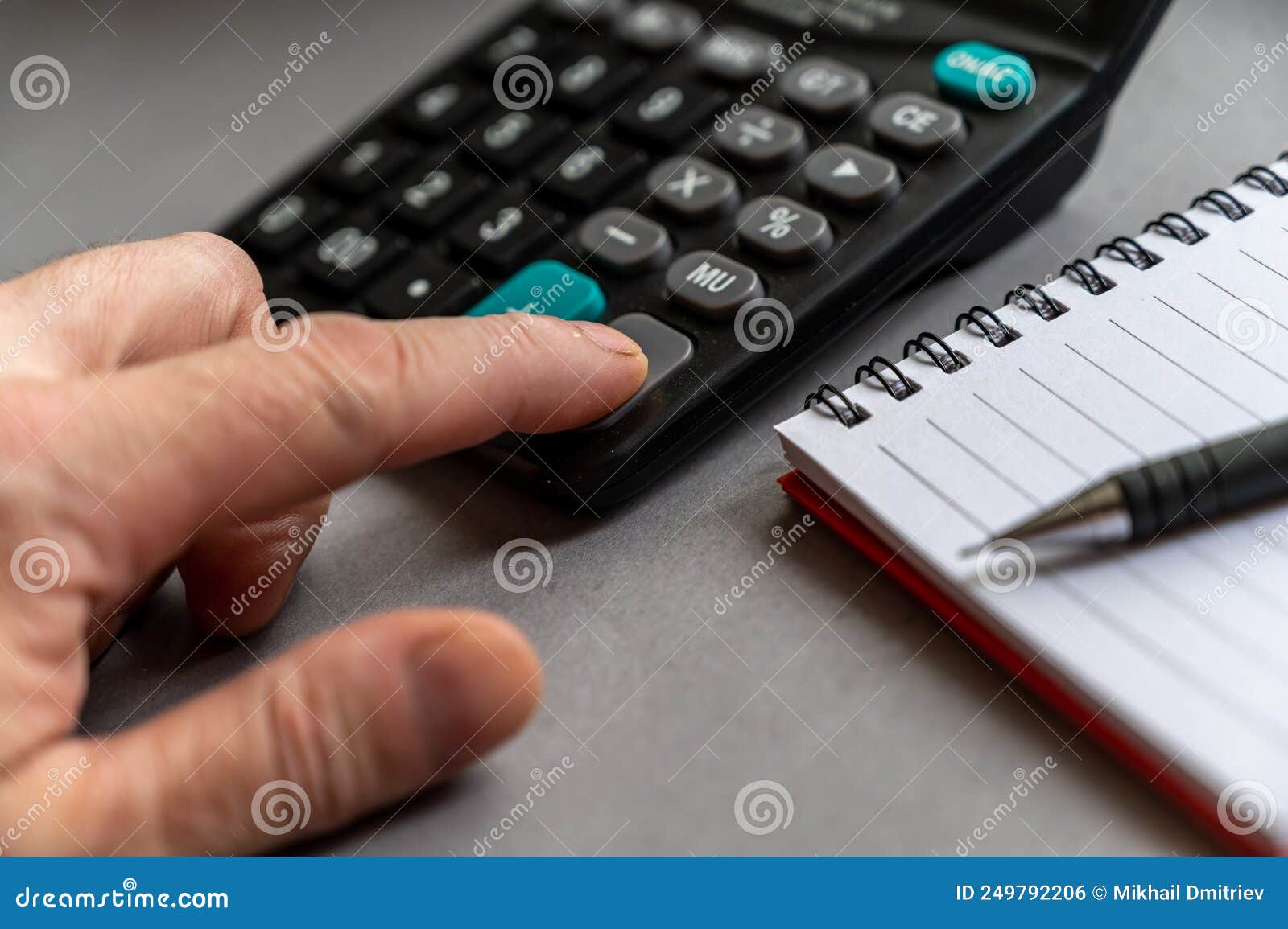 Close-up of a Man`s Hand Doing Calculations on a Calculator. the Index ...